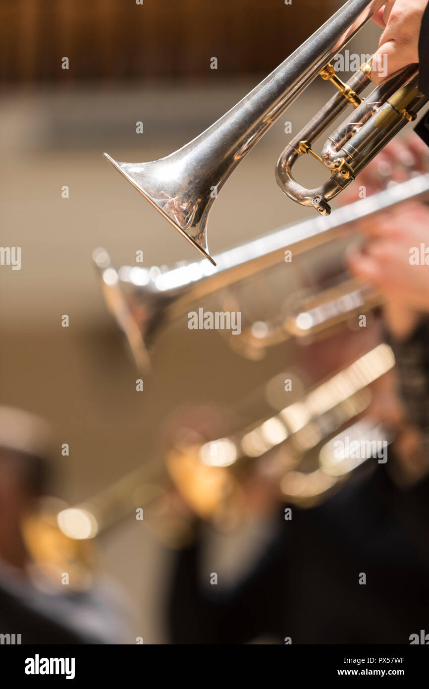 People playing silver plated trumpets during a concert Stock Photo - Alamy