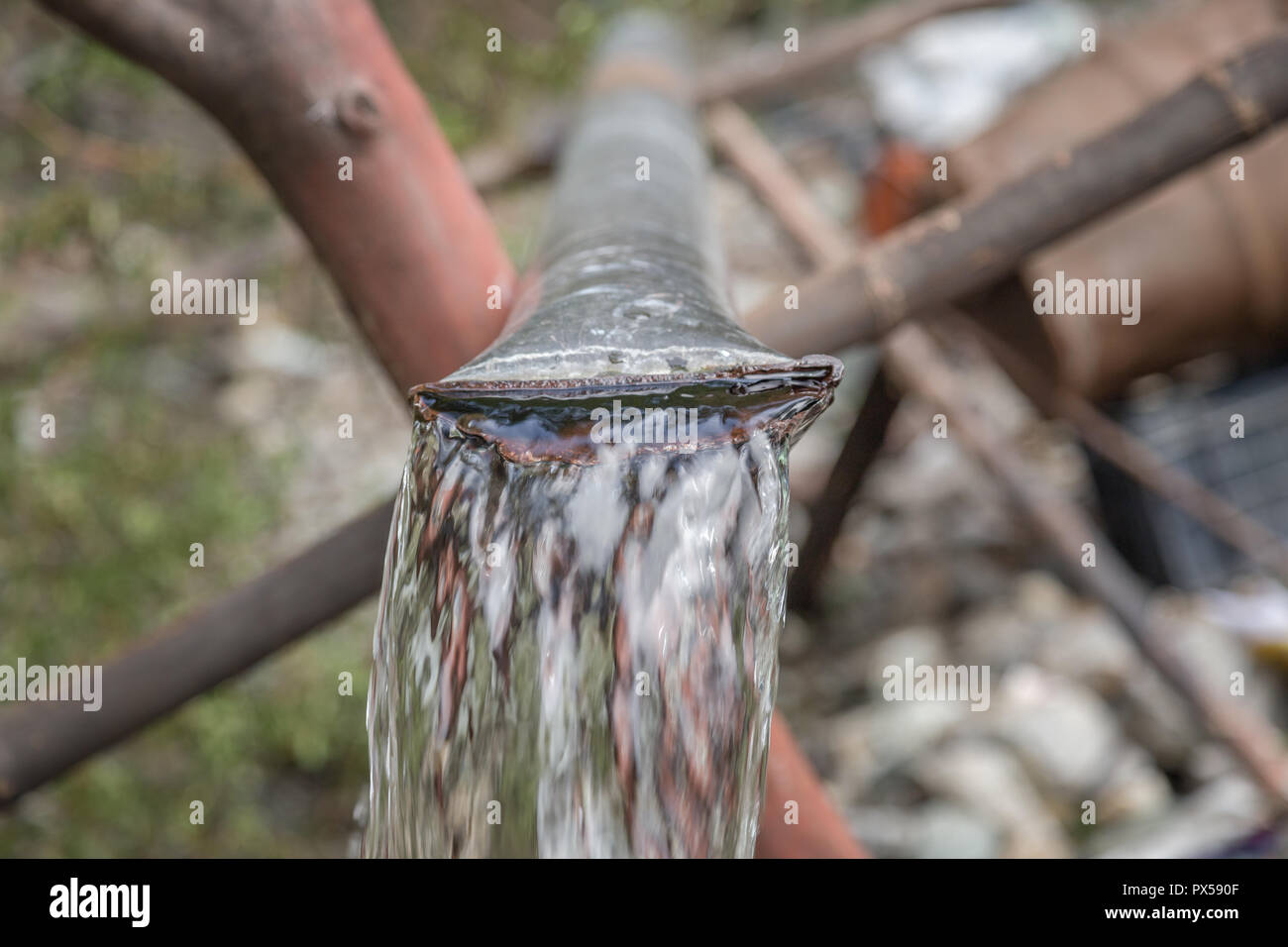 Spring Water Comes Out Of steel pipe in hilly area of uttarakhand Stock ...