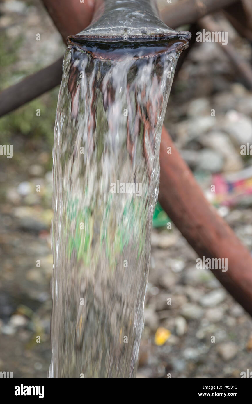 Spring Water Comes Out Of steel pipe in hilly area of uttarakhand Stock ...