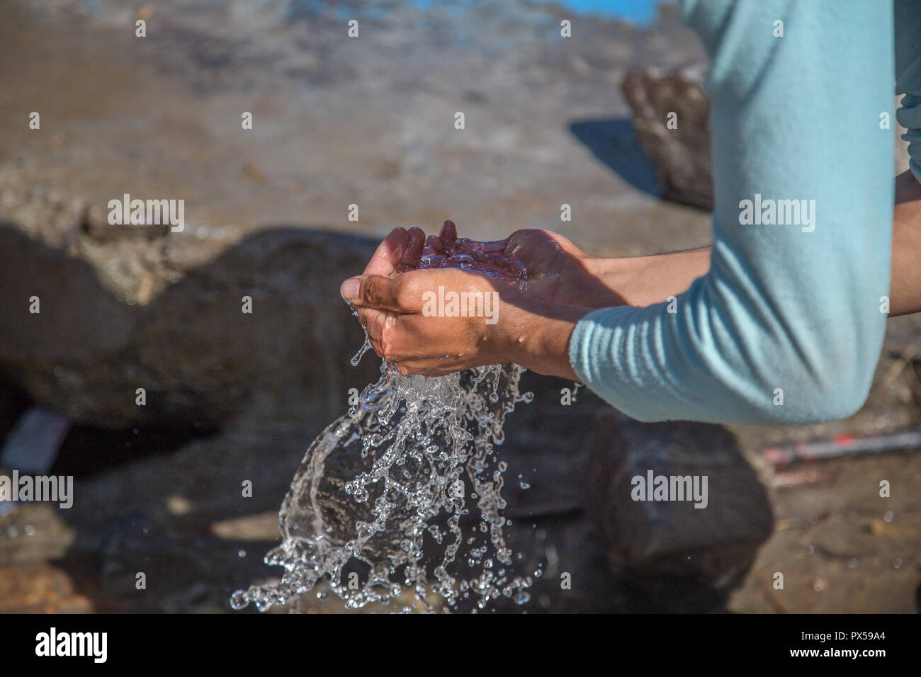 Hands of Poor man Scoop Drinking Water Stock Photo - Alamy