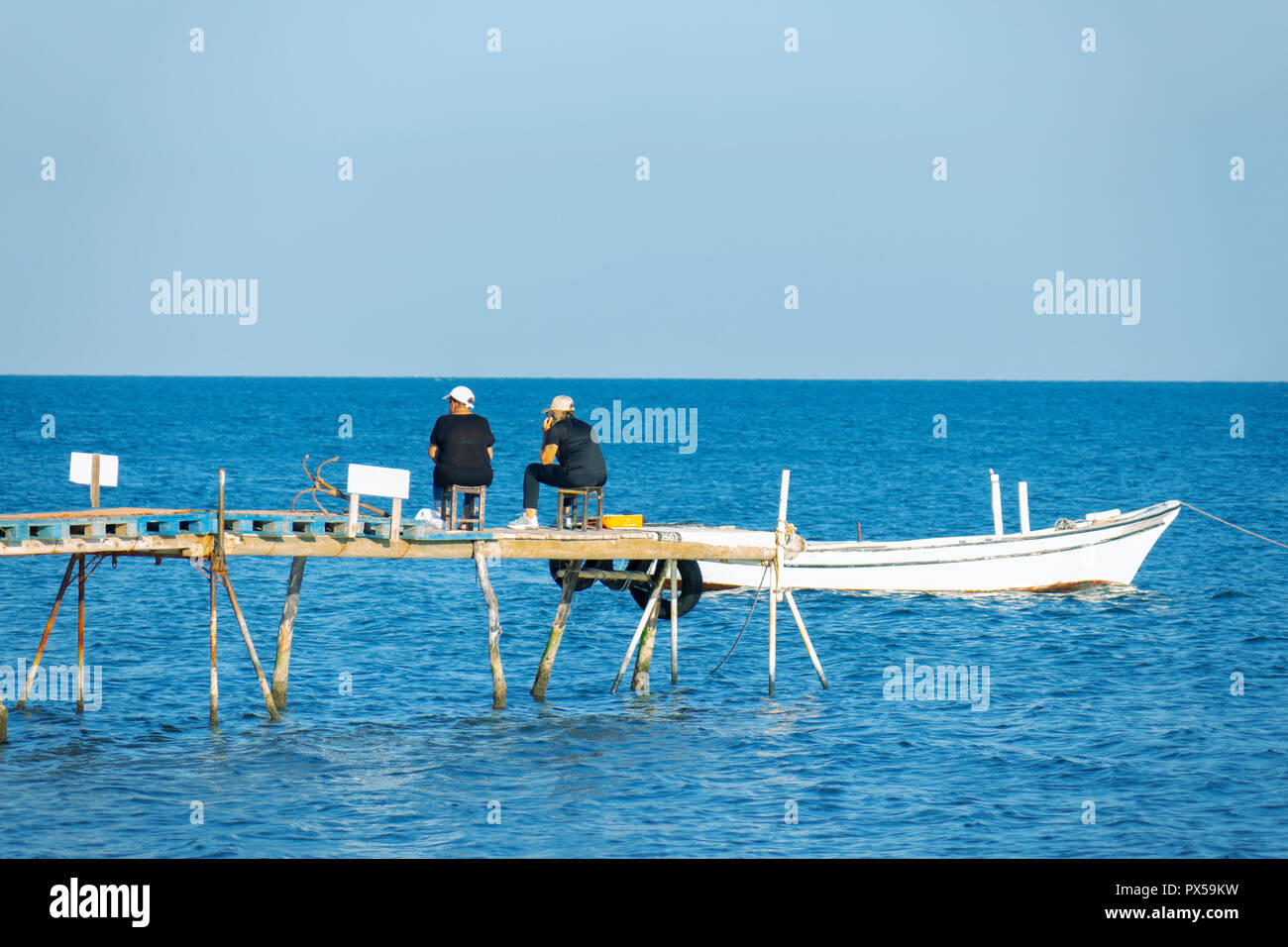 Beach and scaffolding at sunset Stock Photo - Alamy