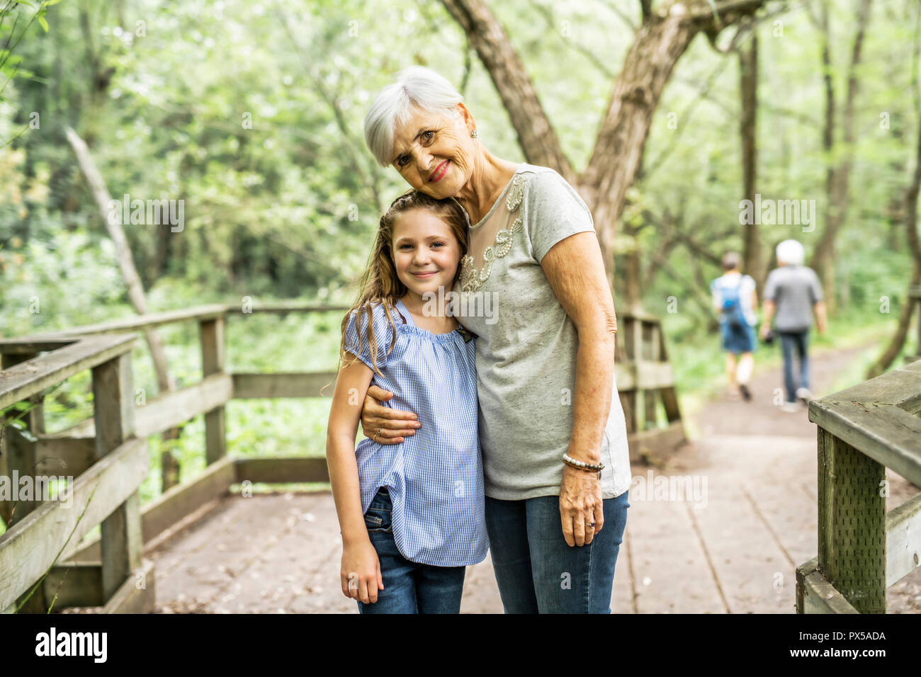 Grandmother and granddaughter spend the weekend in the park Stock Photo ...