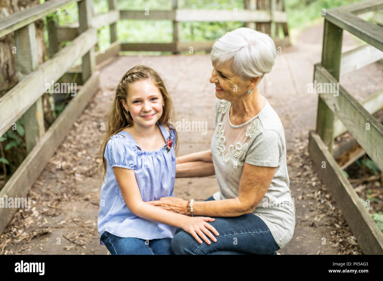 Grandmother and granddaughter spend the weekend in the park Stock Photo ...
