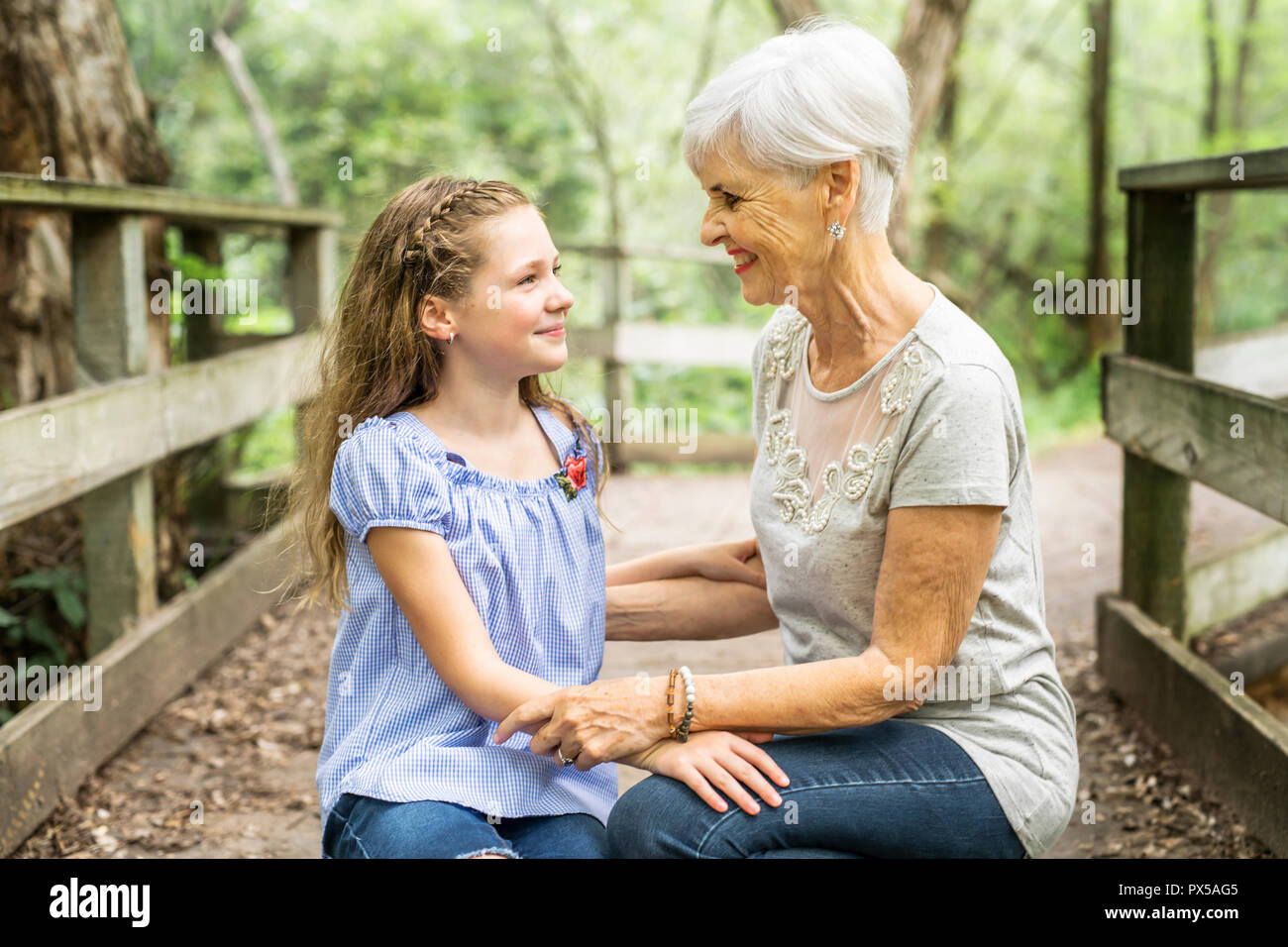 Grandmother and granddaughter spend the weekend in the park Stock Photo ...