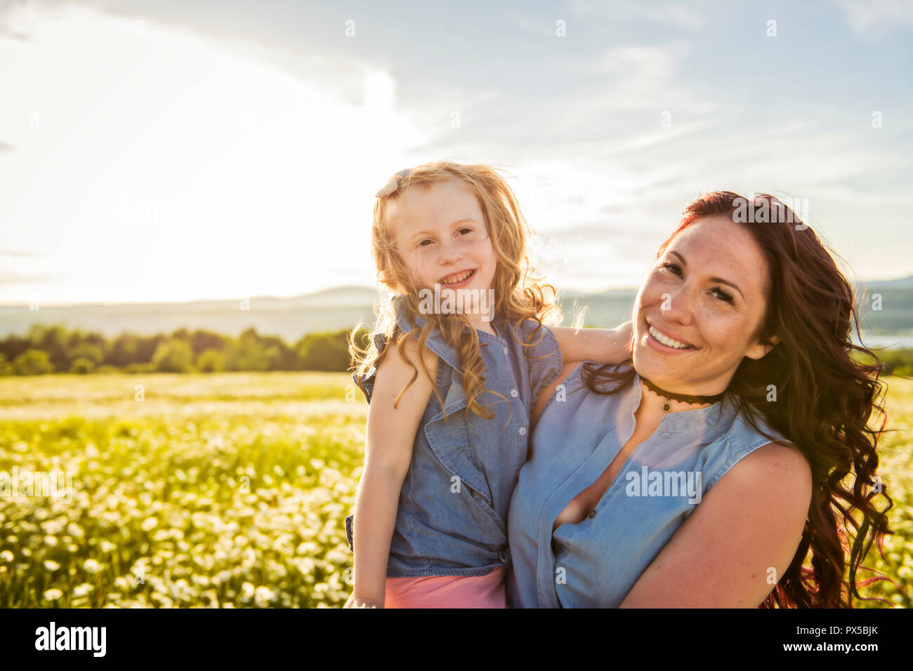 Mother spending time with daughter during the sunset Stock Photo - Alamy