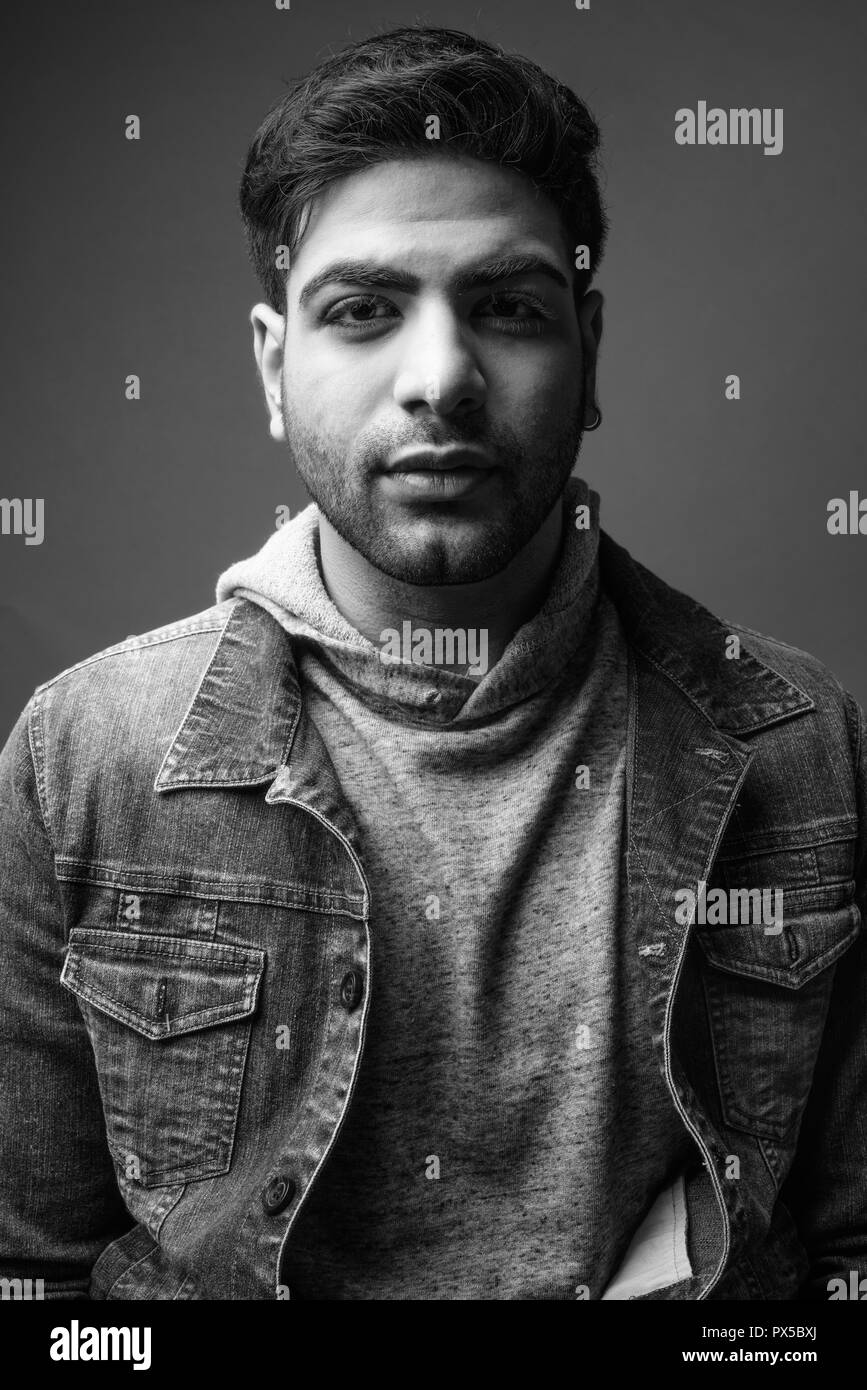 Handsome indian man in black hi-res stock photography and images - Alamy