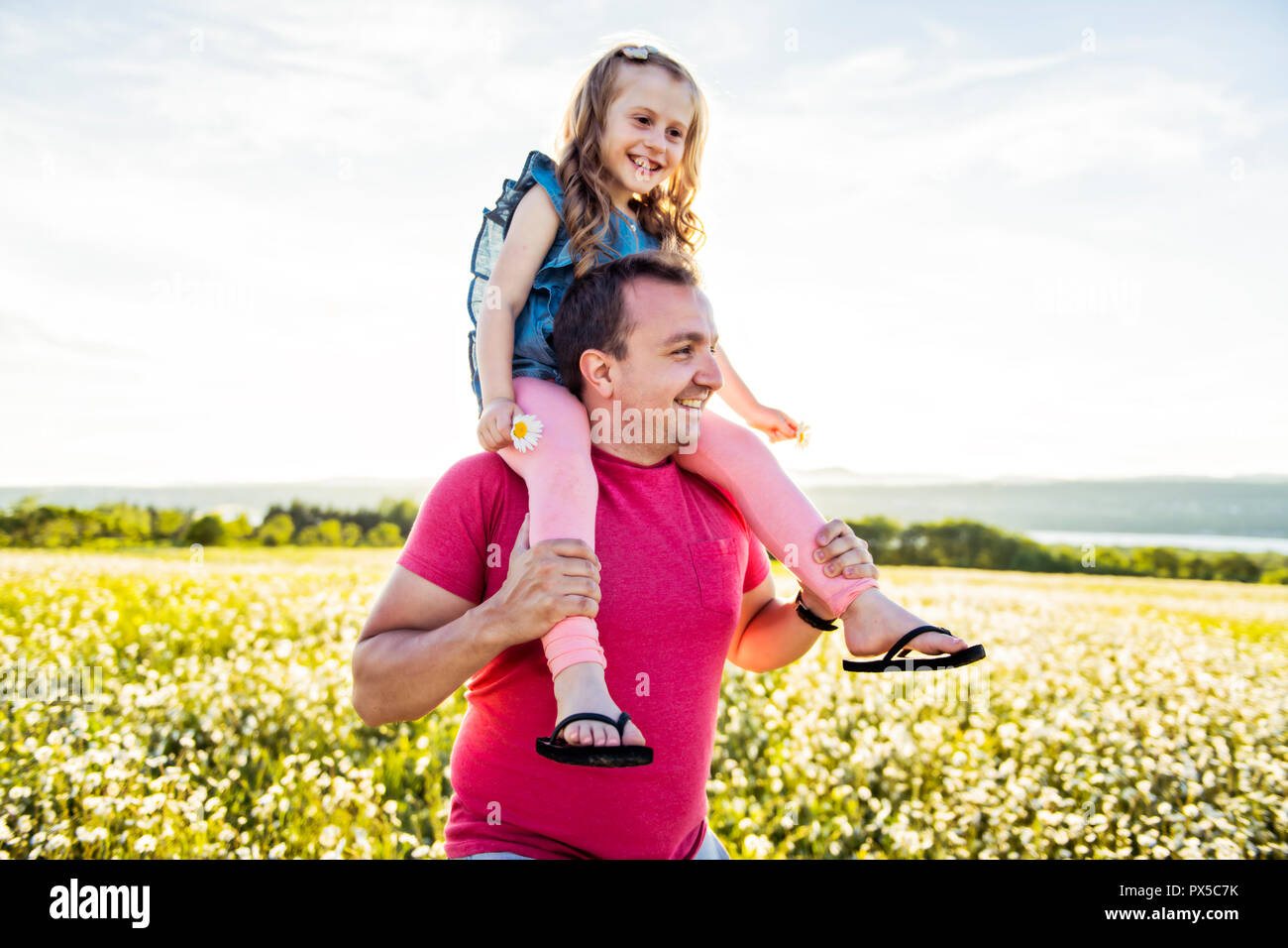 Father spending time with daughter during the sunset Stock Photo - Alamy