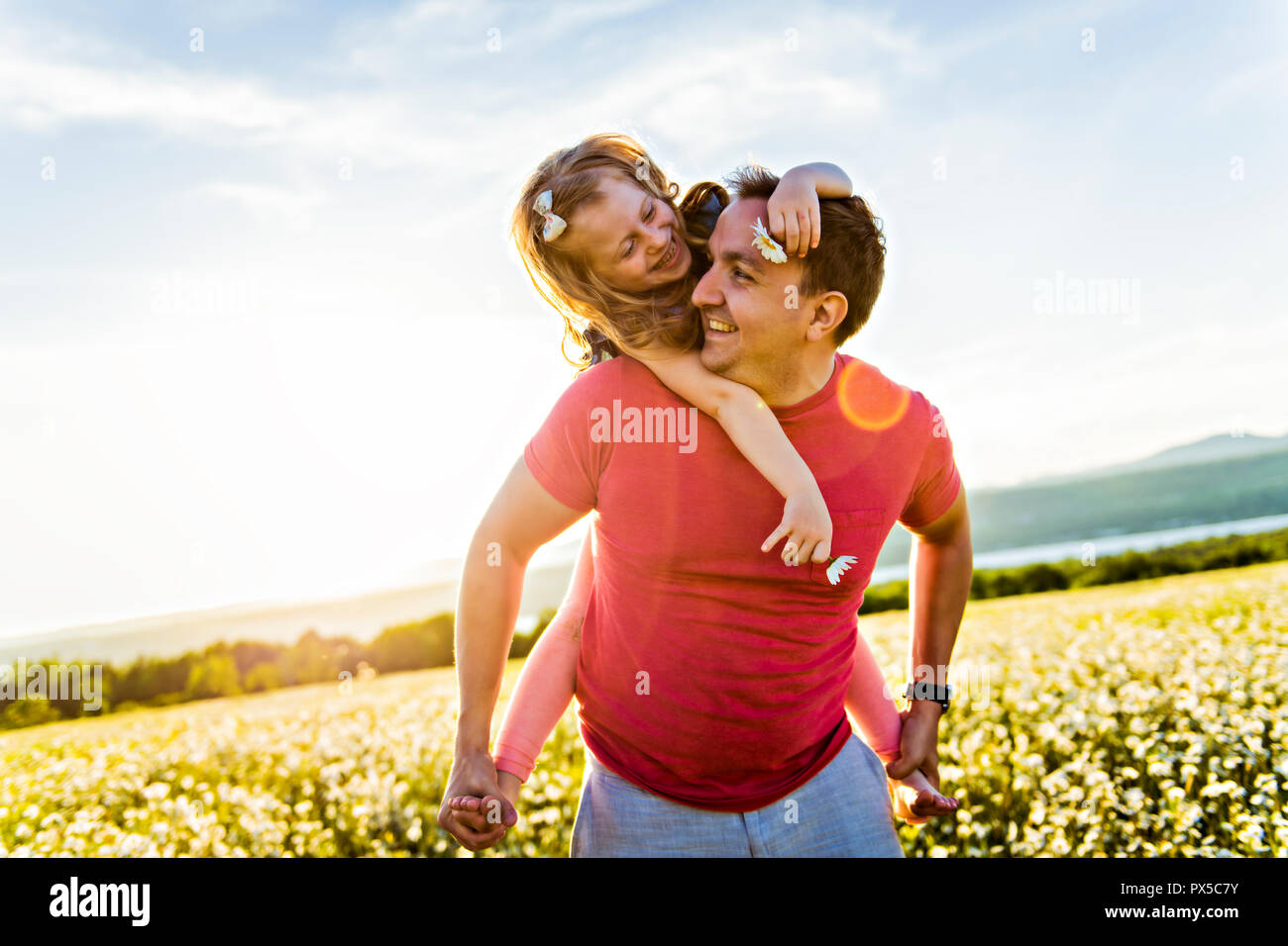 Father spending time with daughter during the sunset Stock Photo - Alamy