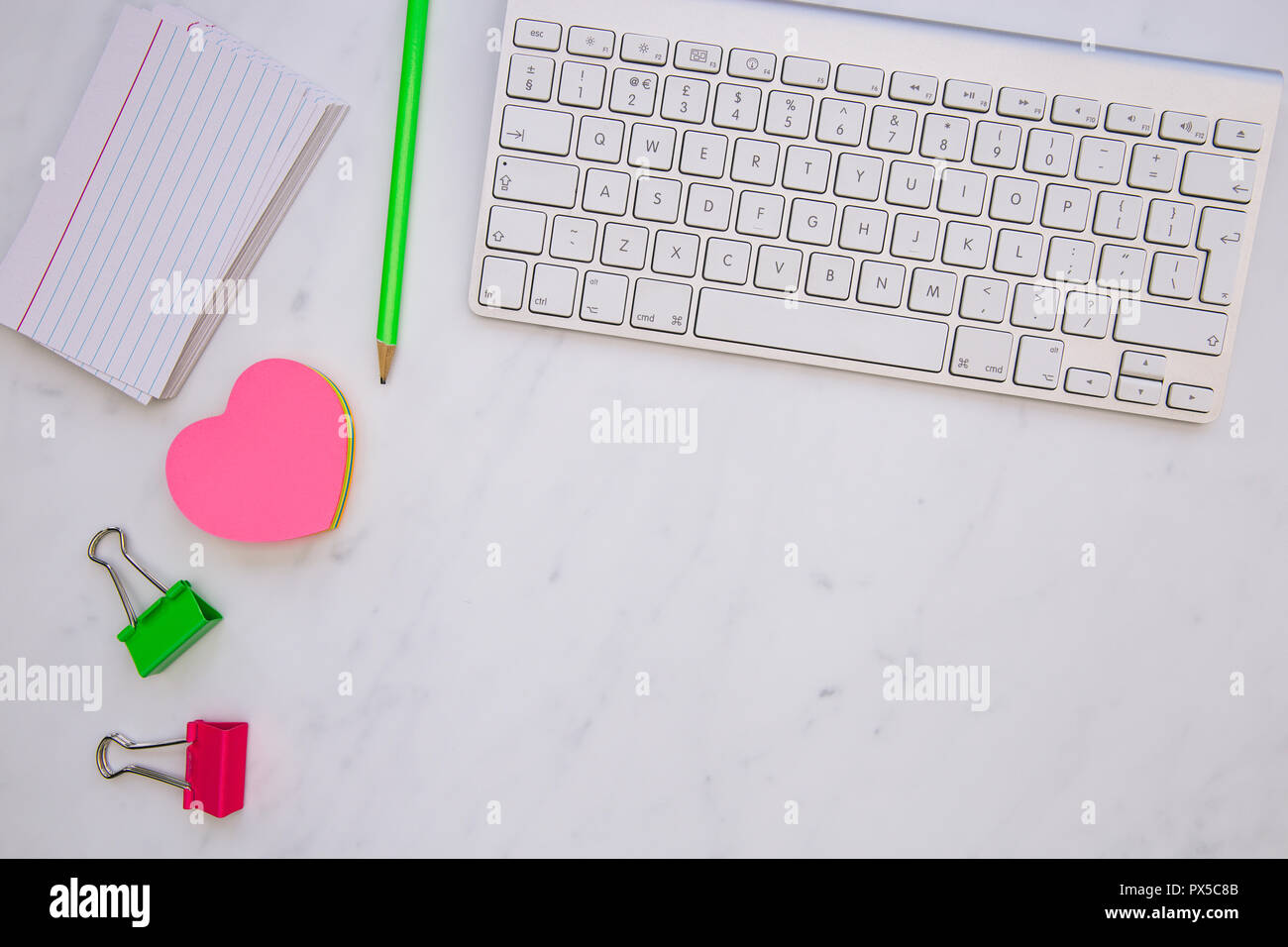Computer keyboard minimal on white marble background Stock Photo - Alamy