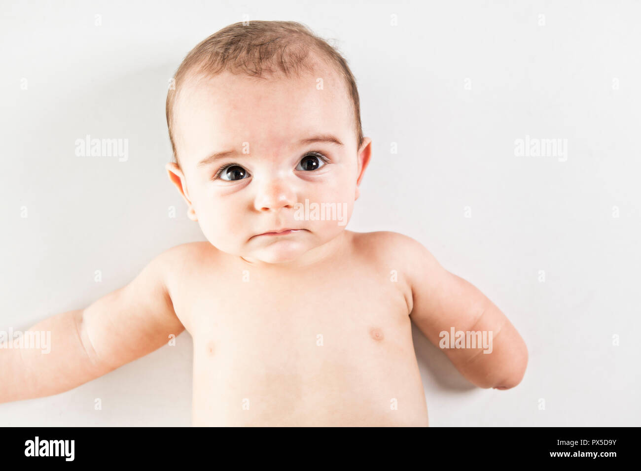 One hand Baby boy portrait on white background lay Stock Photo - Alamy
