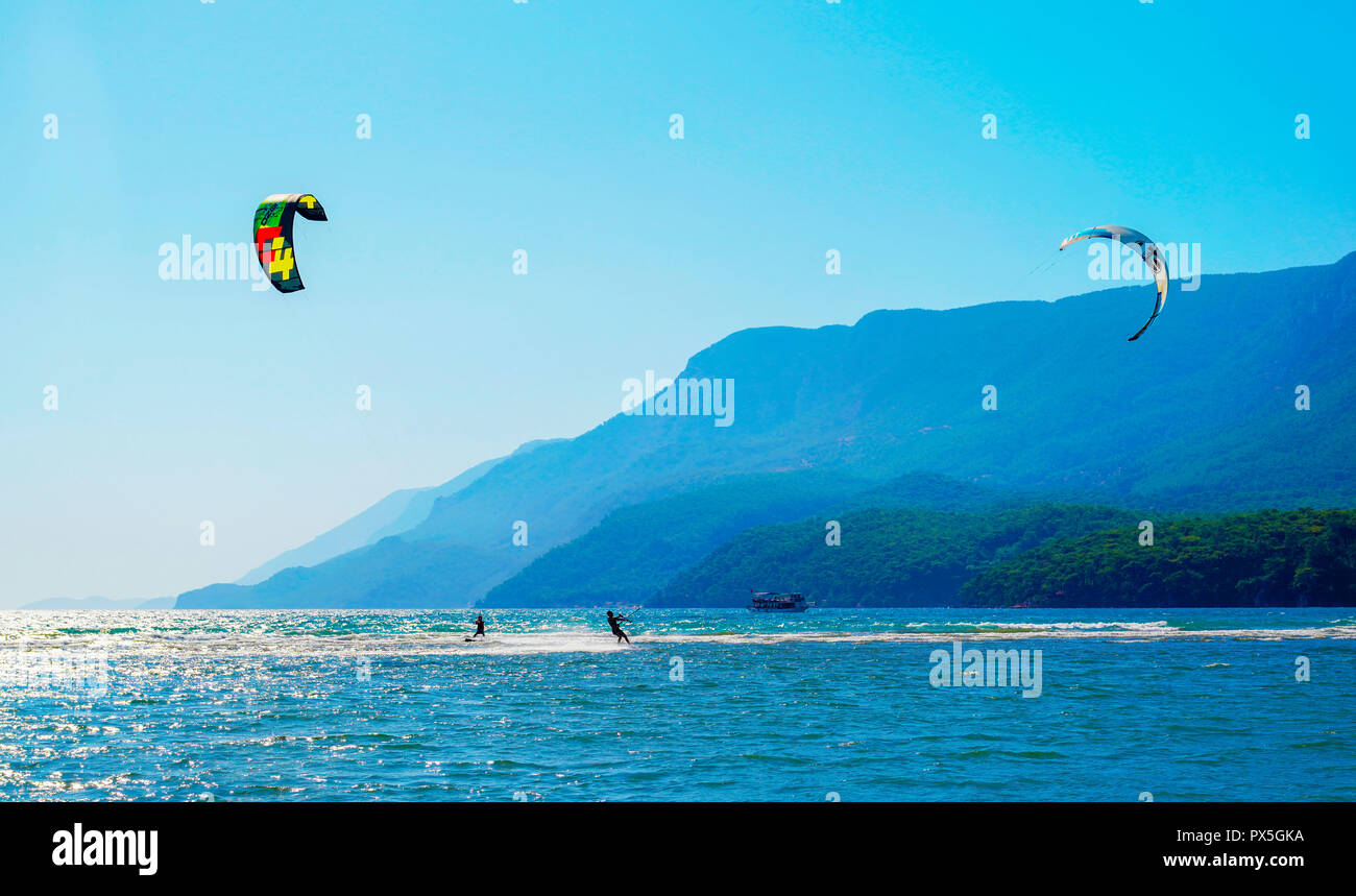 Akyaka, Mugla/Turkey-August 14 2018: Two surfers enjoying kite surfing ...