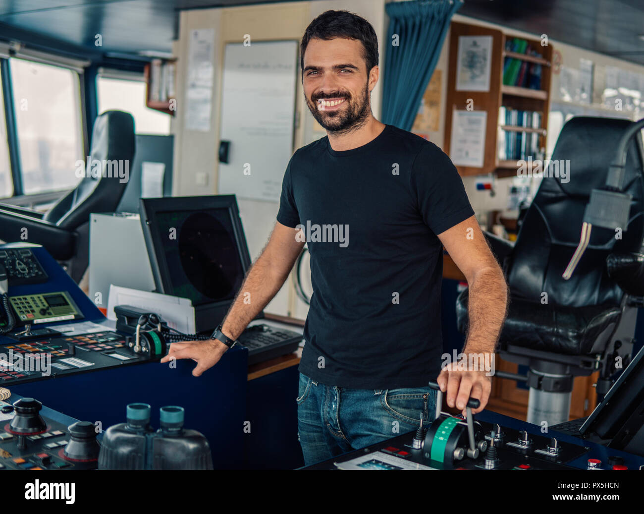 Marine navigational officer is maneuvering ship or vessel Stock Photo ...