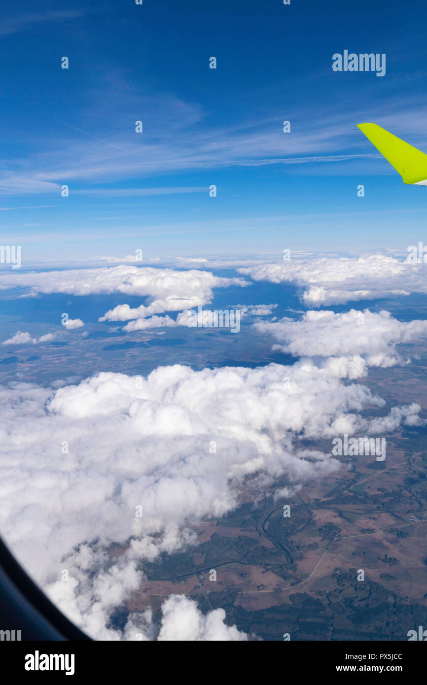 Classic image through aircraft window onto jet engine, wing of airplane ...