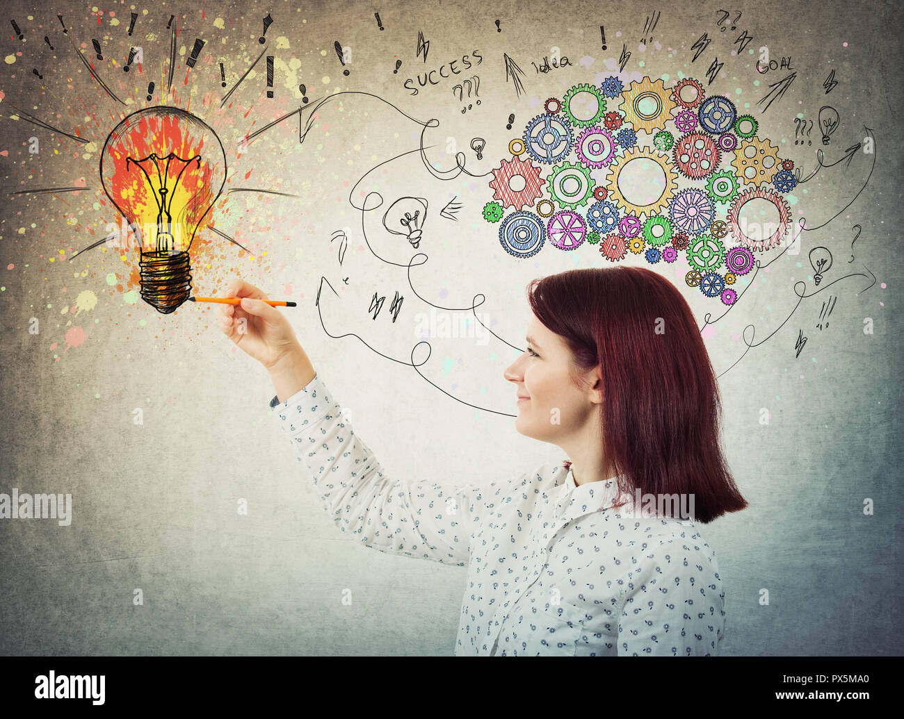 Young woman with colorful gear brain above head, positive emotion ...