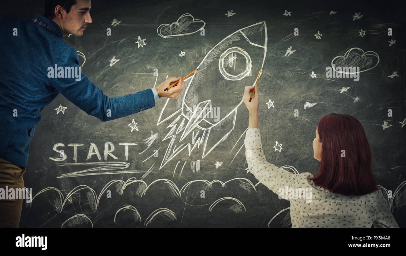 Man and woman sharing thoughts together drawing rocket start on ...