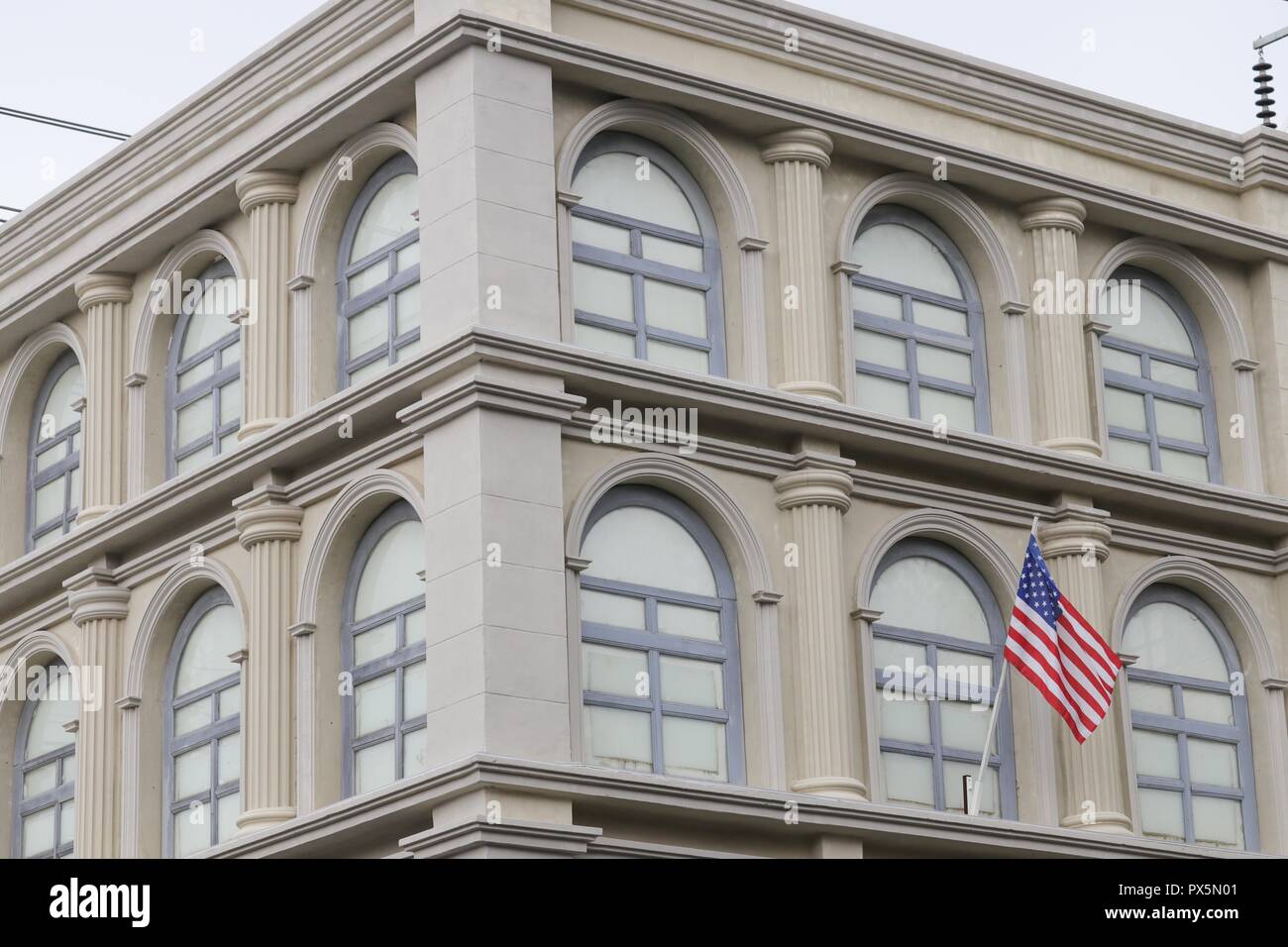 American flag on building, the proudly displaying their Stock Photo - Alamy