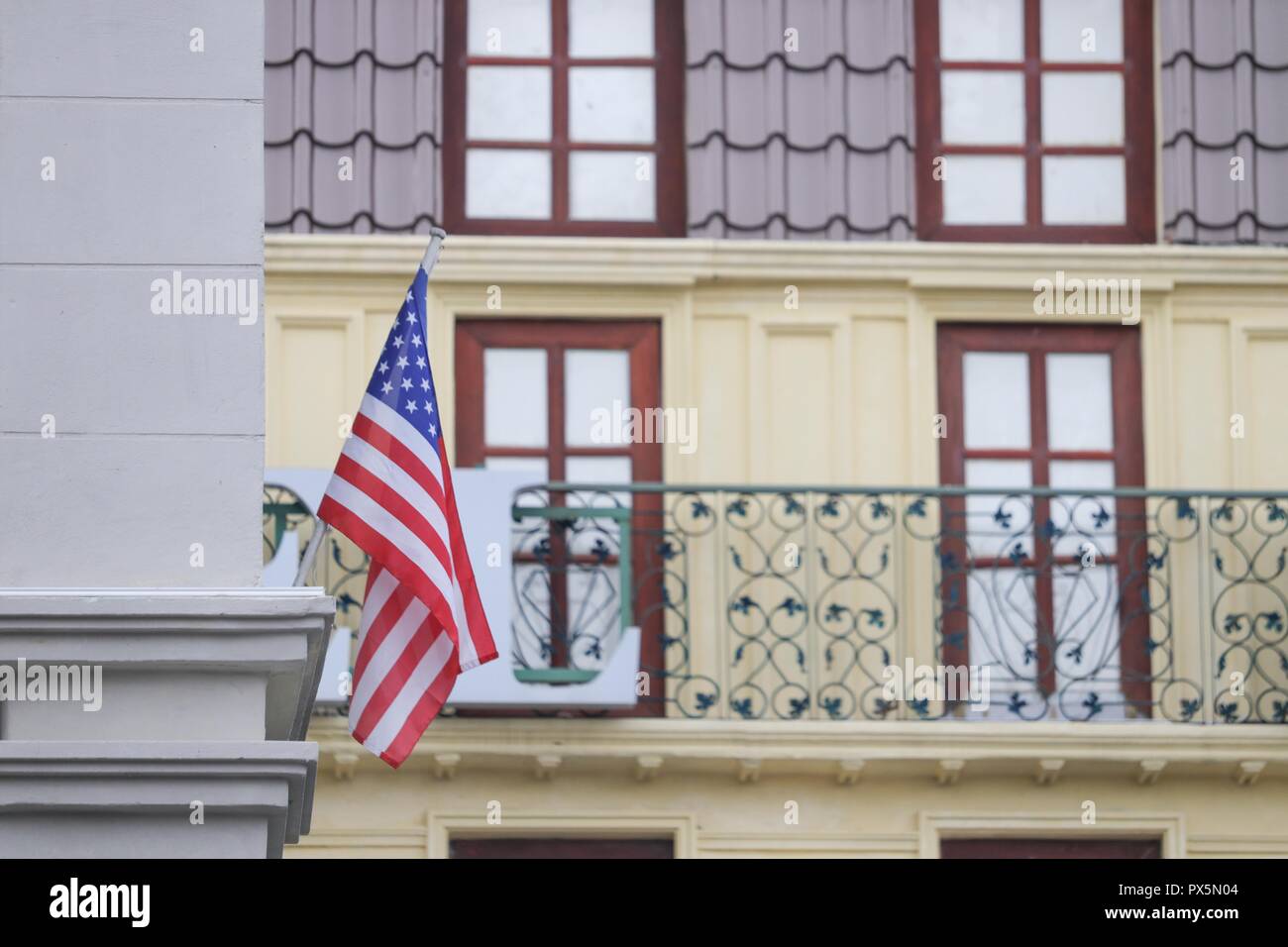 American flag on building, the proudly displaying their Stock Photo - Alamy
