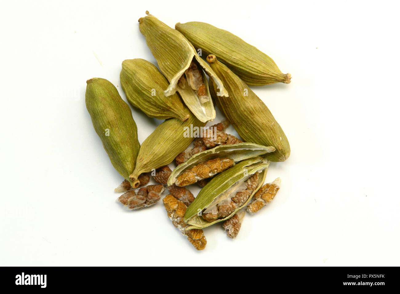 Green cardamom spice on white background Stock Photo - Alamy