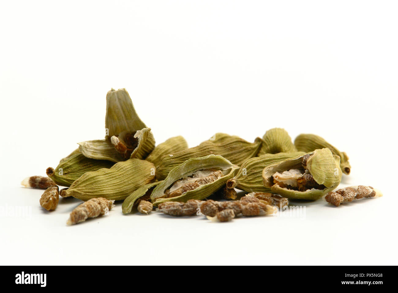 Green cardamom spice on white background Stock Photo - Alamy