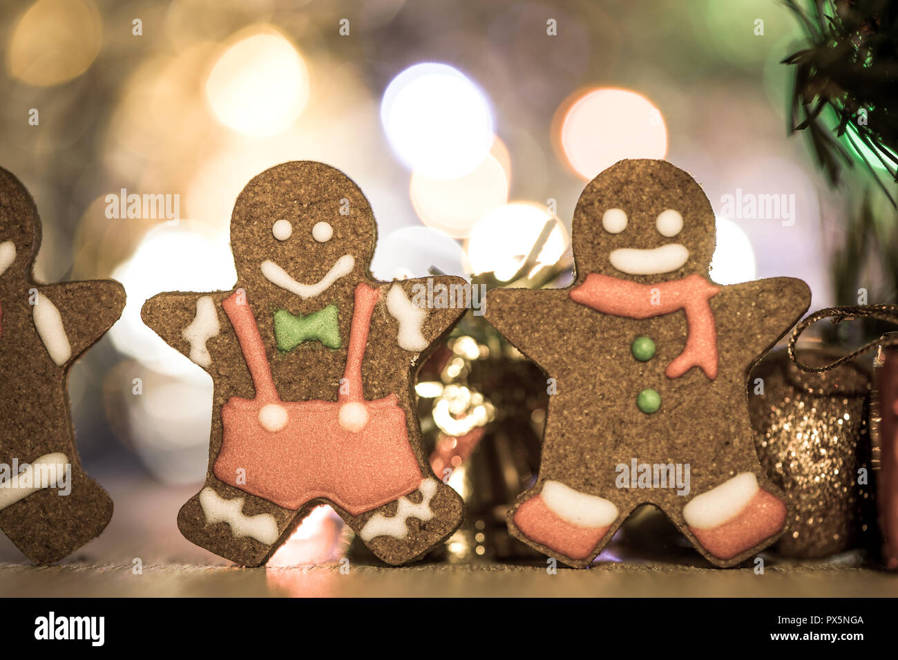 Cute gingerbread man with christmas tree and blurry sparkle background ...