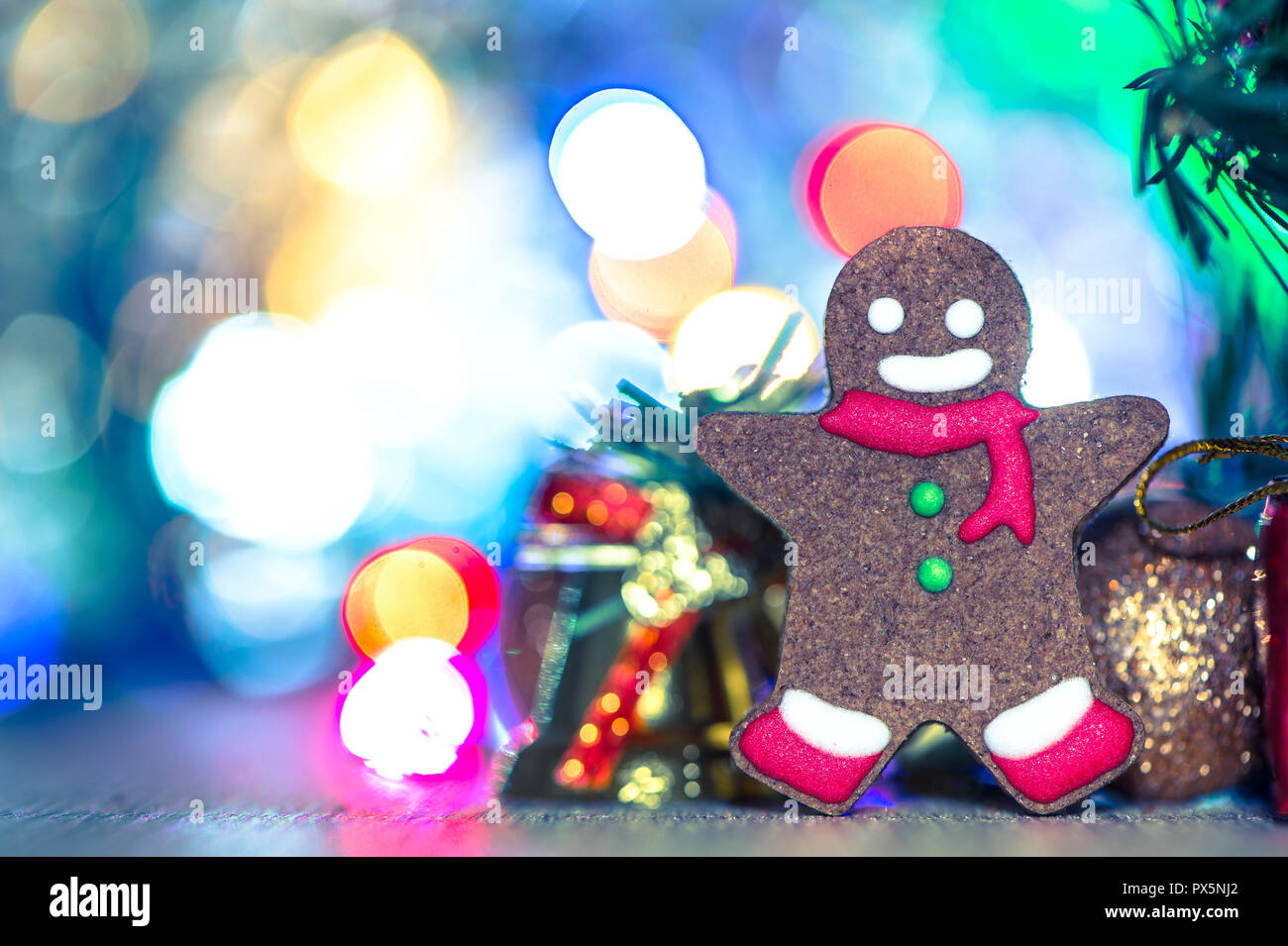 Cute gingerbread man with christmas tree and blurry sparkle background ...