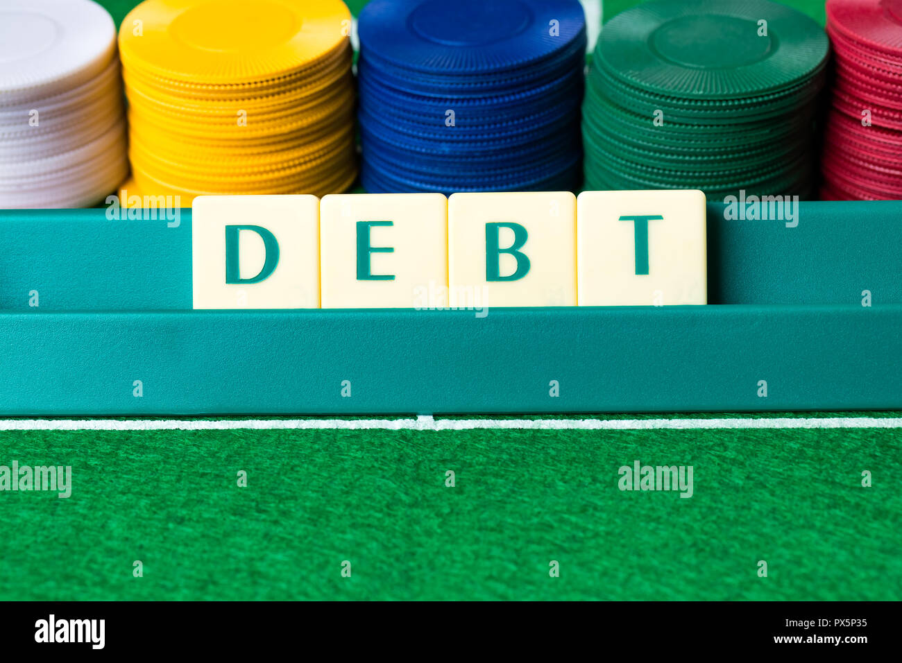 Gambling addiction abstract concept. Debt made out of letter tiles ...