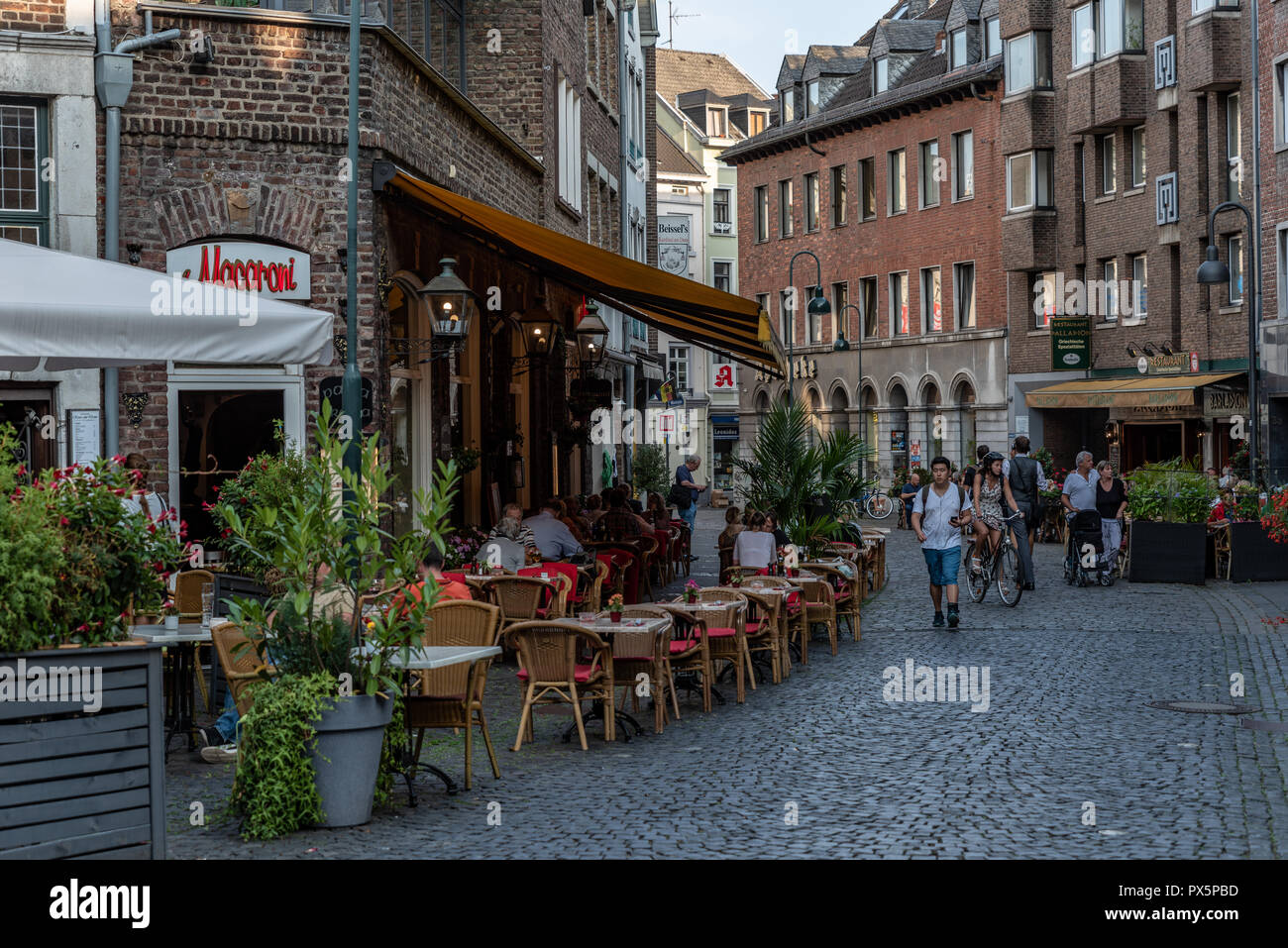 People enjoying eating at restaurants in the street of Aachen Stock ...