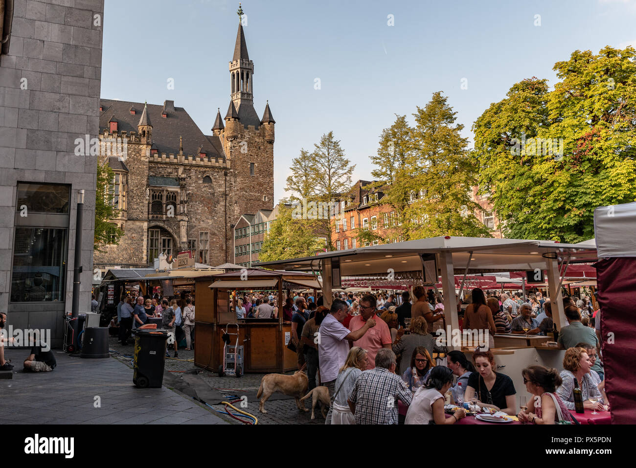 People enjoy the busy wine festival in the square in Aachen Stock Photo ...