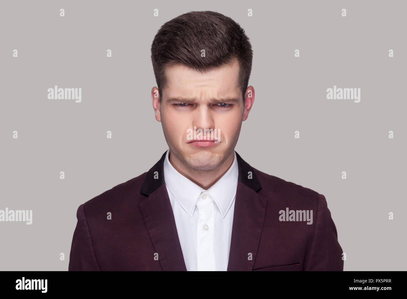 Young man sad suit hi-res stock photography and images - Alamy