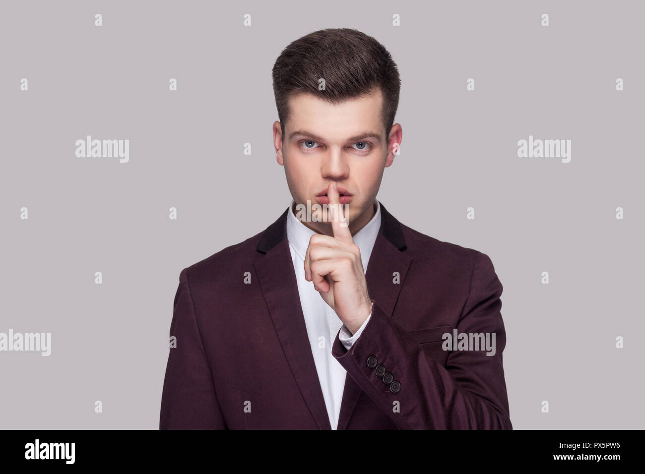 Serious young man suit hi-res stock photography and images - Alamy