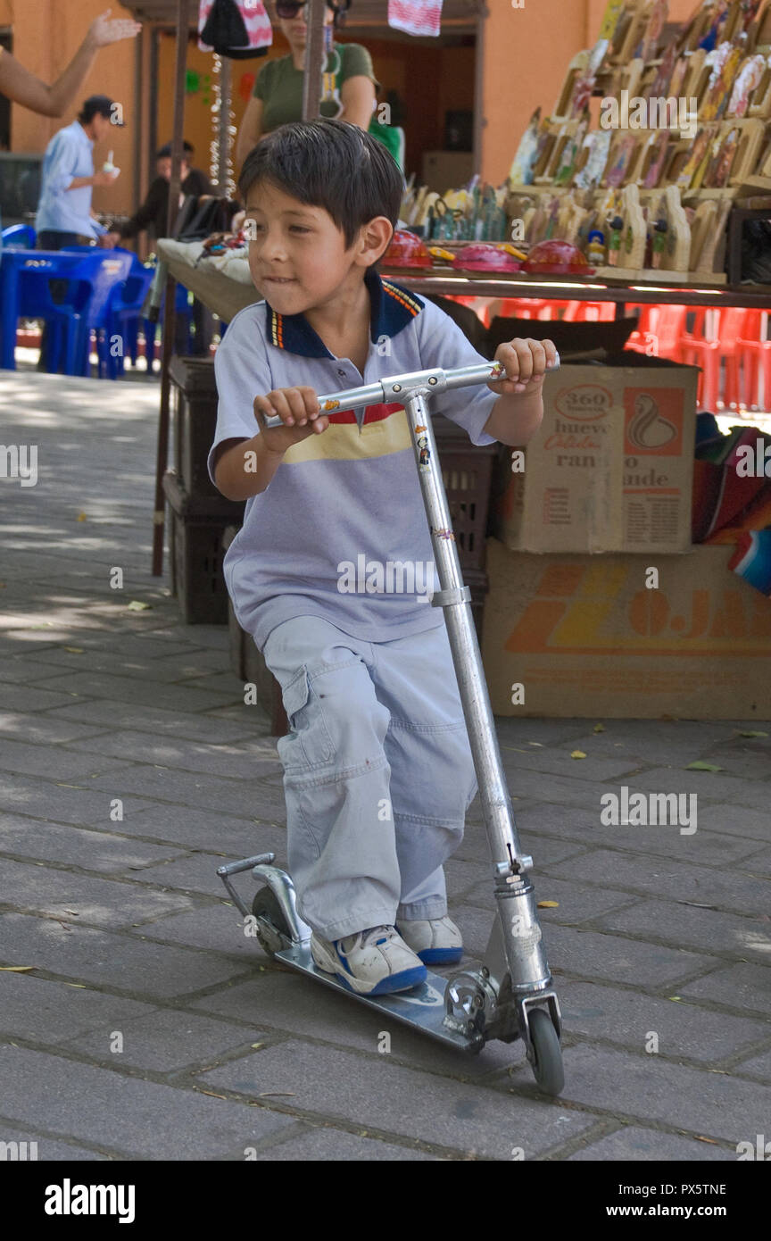 Boy riding scooter at Parque Hidalgo, Tecate, Baja California, Mexico ...