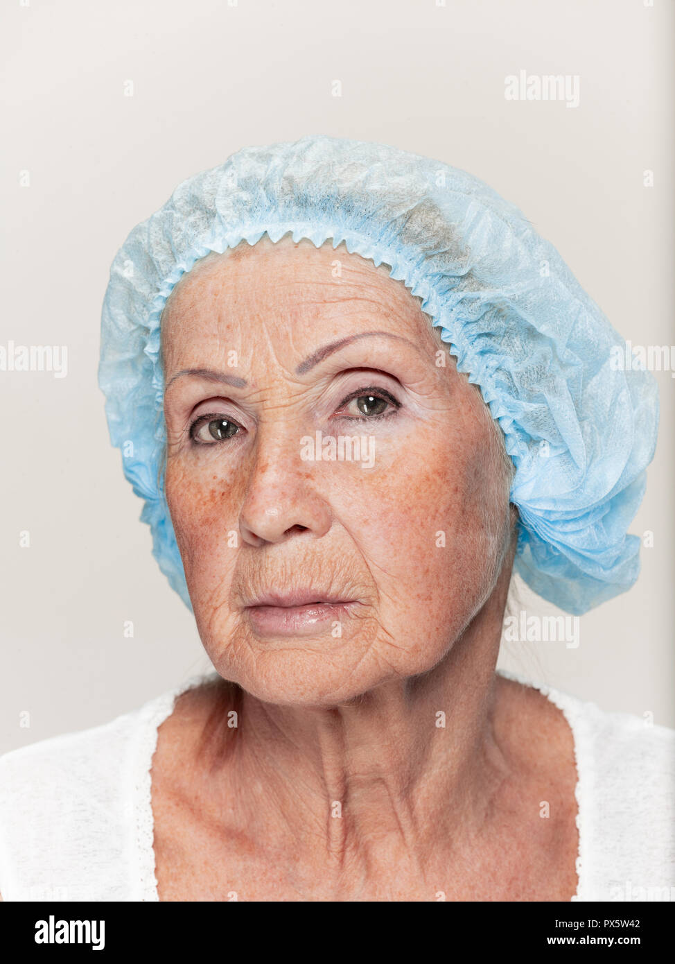 The face of mid age woman before plastic surgery. Senior female model ...