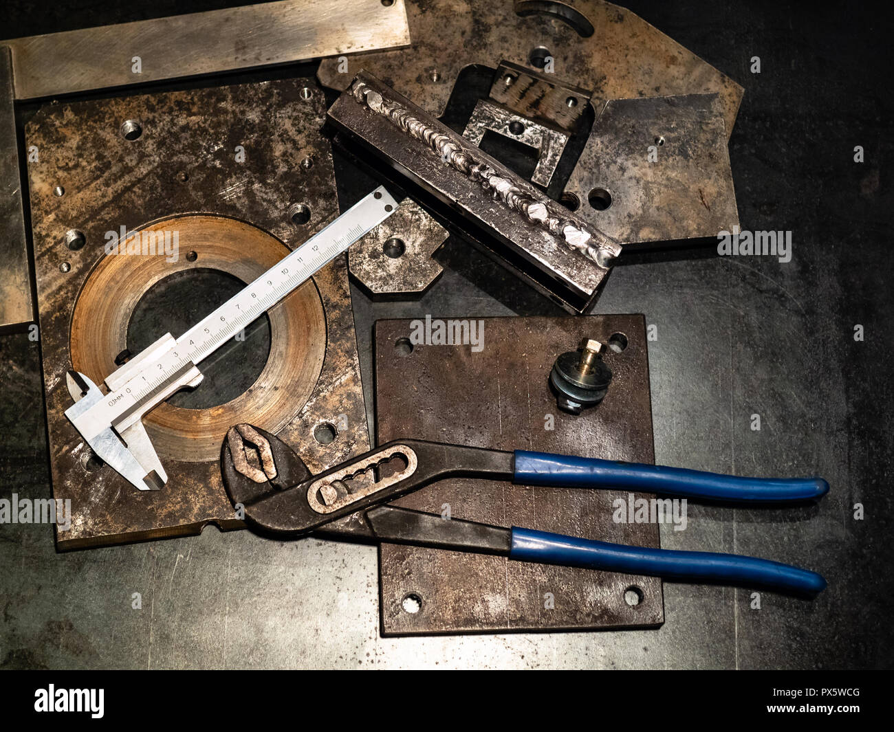 Metalworking still life - top view of callipers and adjustable pliers ...