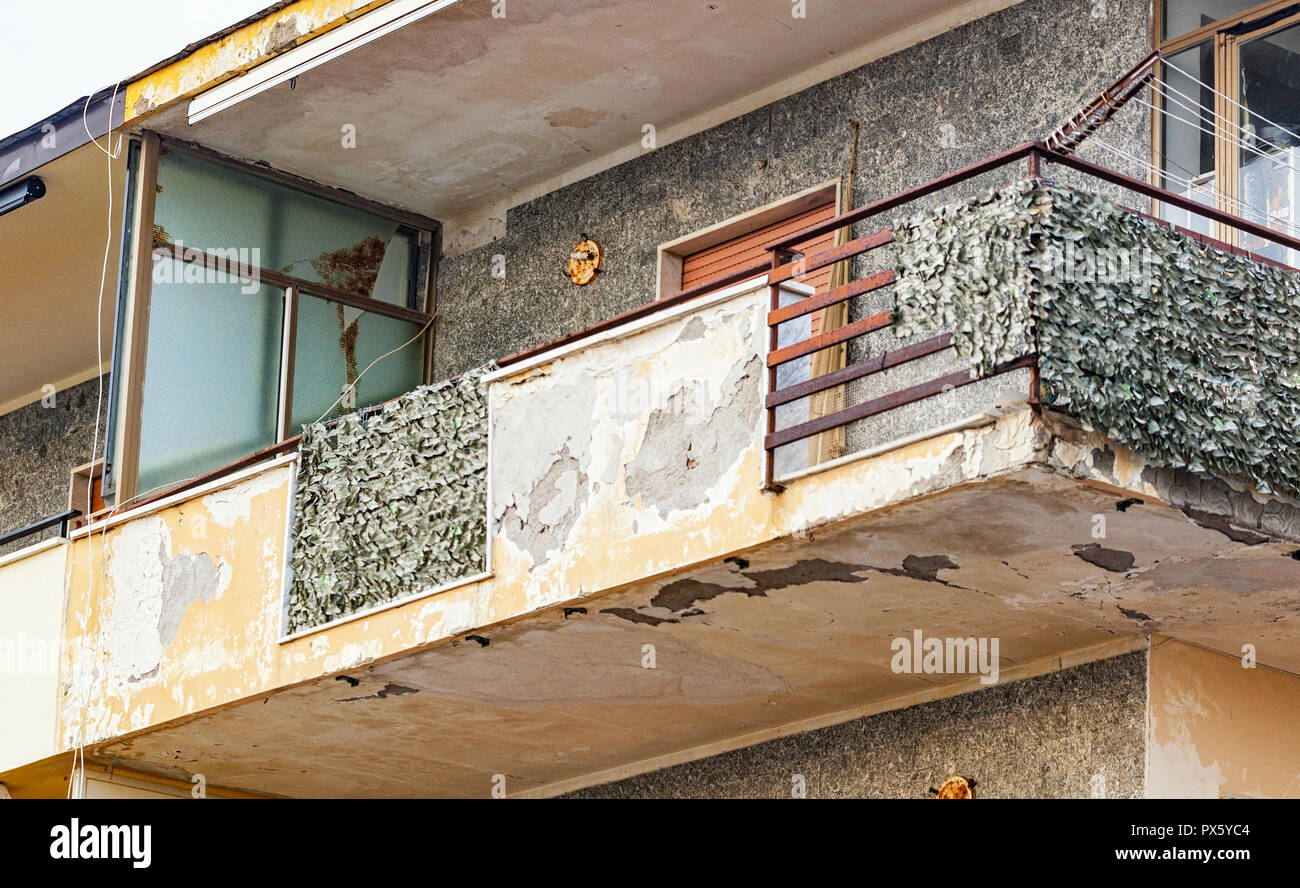 Balcony with cracked concrete and rusty irons requiring renovation ...