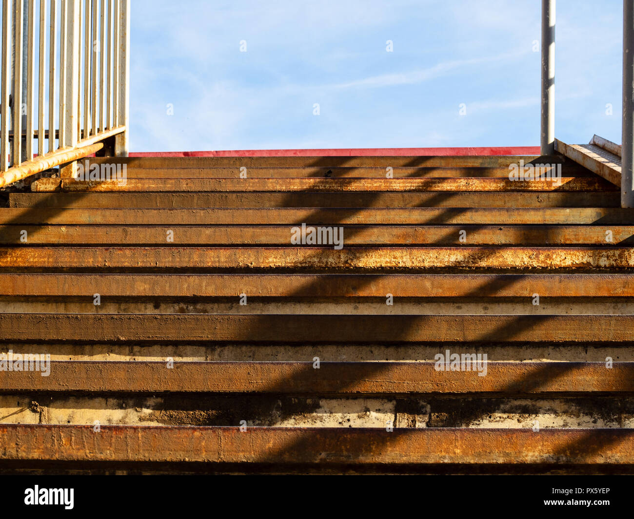 rusty steps of metal outdoor stairs in sunny day Stock Photo - Alamy