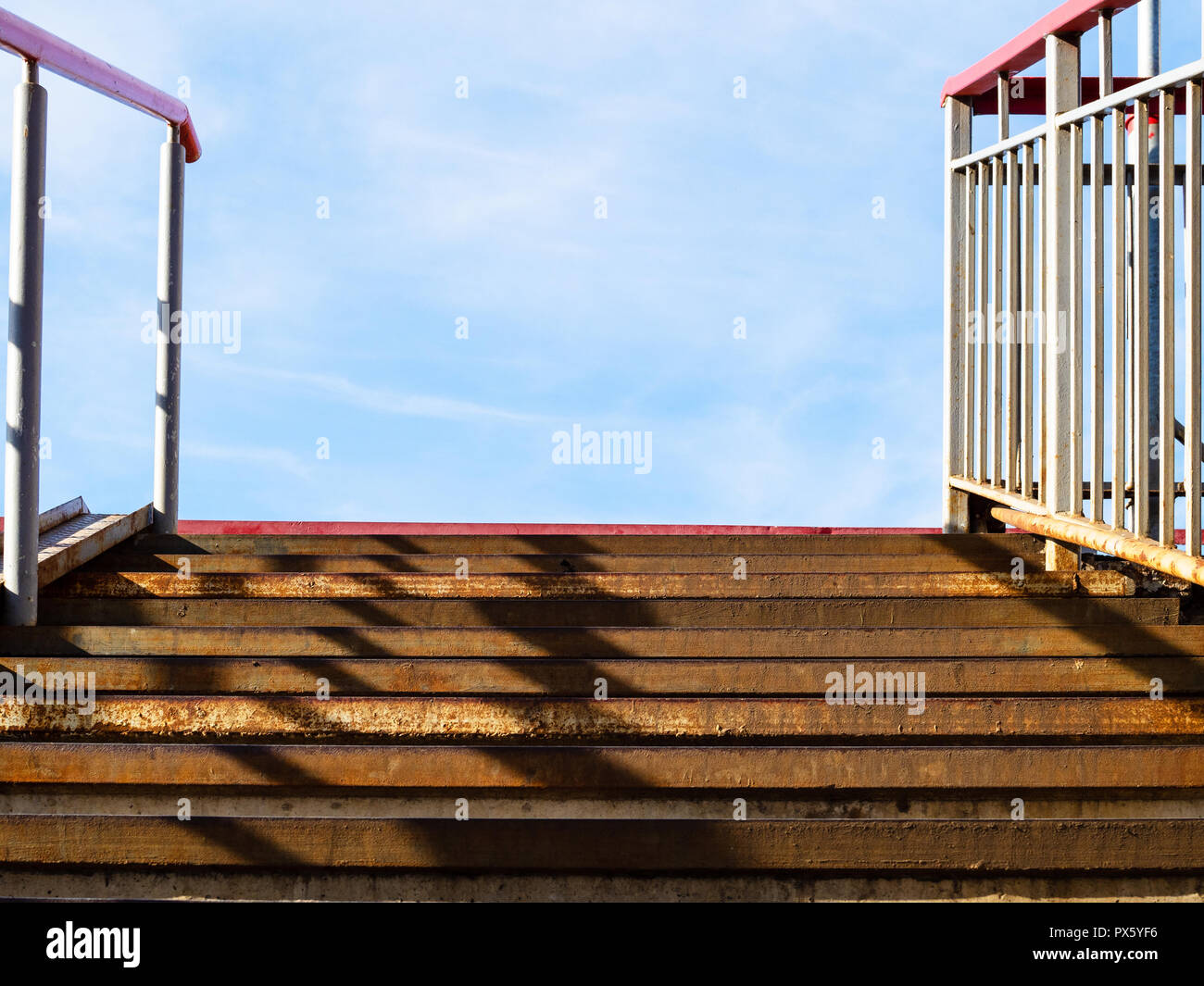 rusty steps of metal outdoor stairs to blue sky in sunny day Stock ...