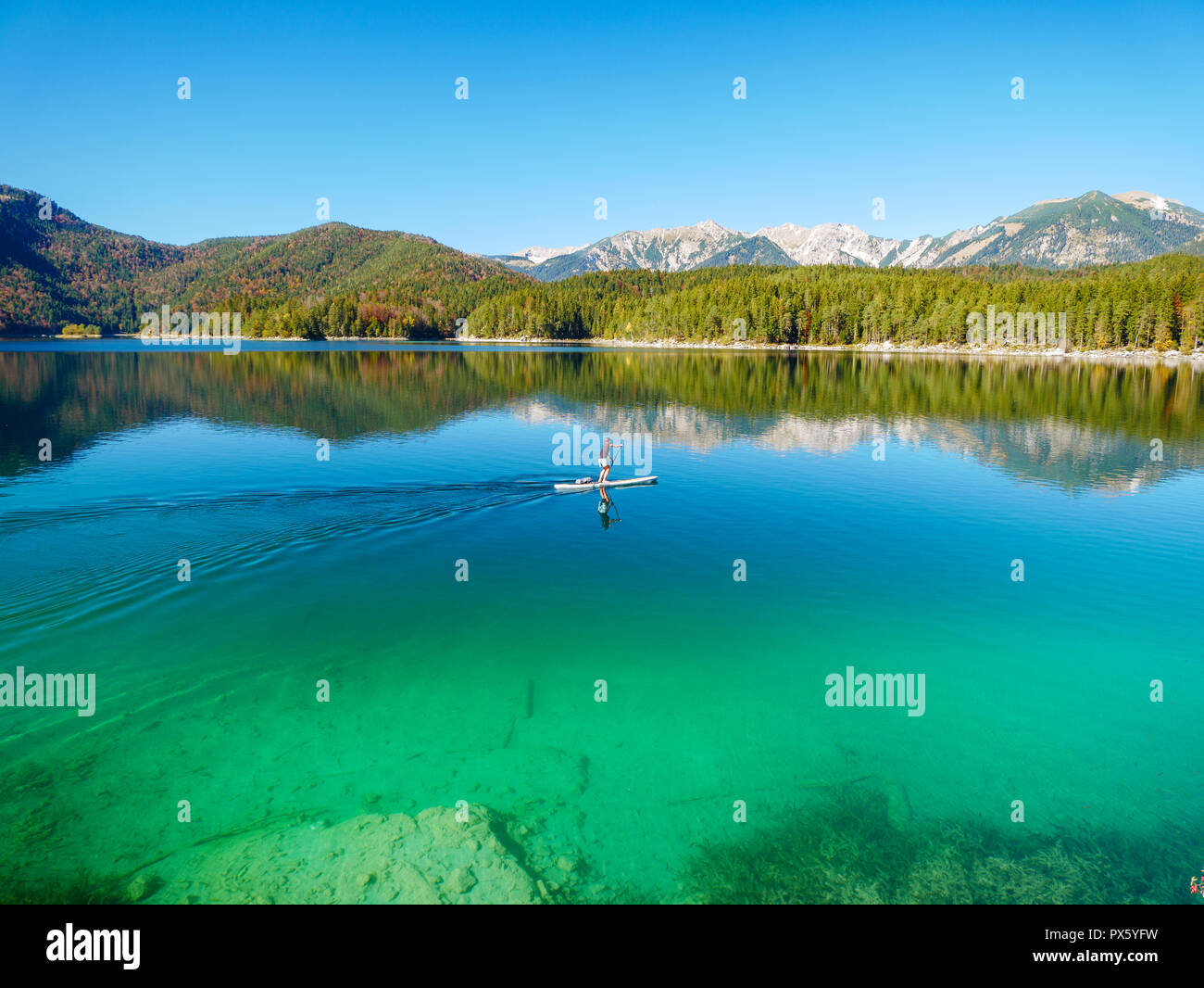 Young woman stand up paddling lake eibsee hi-res stock photography and ...