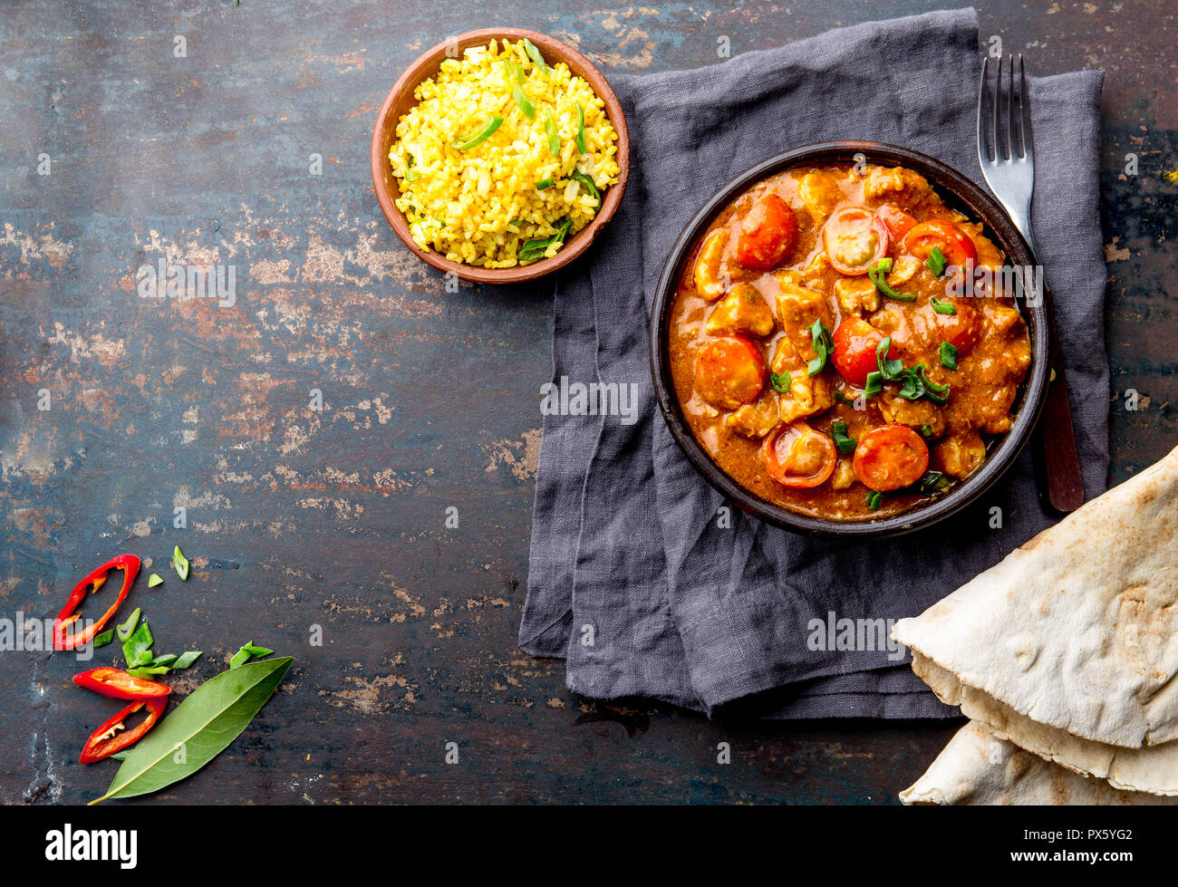 INDIAN FOOD. ROGAN JOSH curry sauce. Pork rogan josh with rice and naan ...