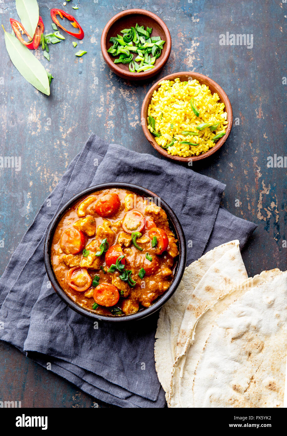 INDIAN FOOD. ROGAN JOSH curry sauce. Pork rogan josh with rice and naan ...