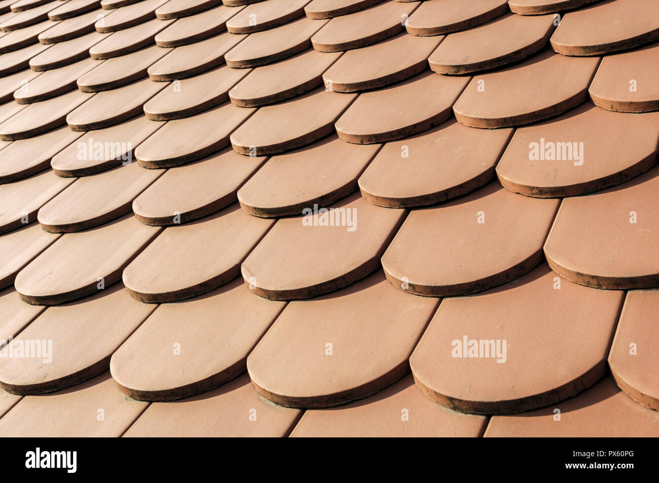 Red roof tiles, newly tiled roof Stock Photo - Alamy