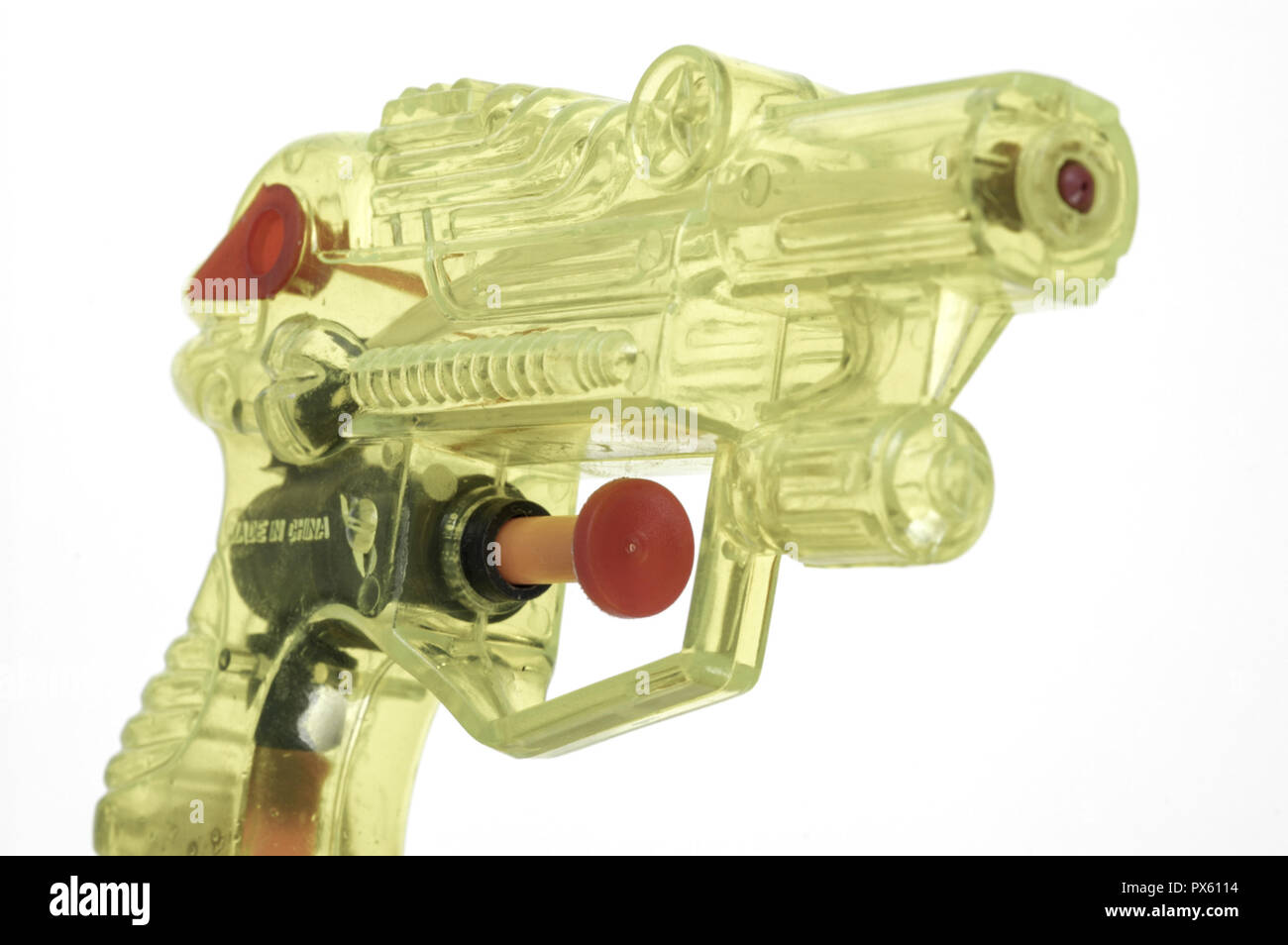 Yellow watergun, toy Stock Photo - Alamy
