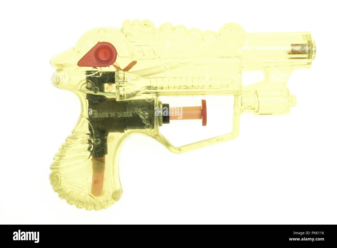 Yellow watergun, toy Stock Photo - Alamy