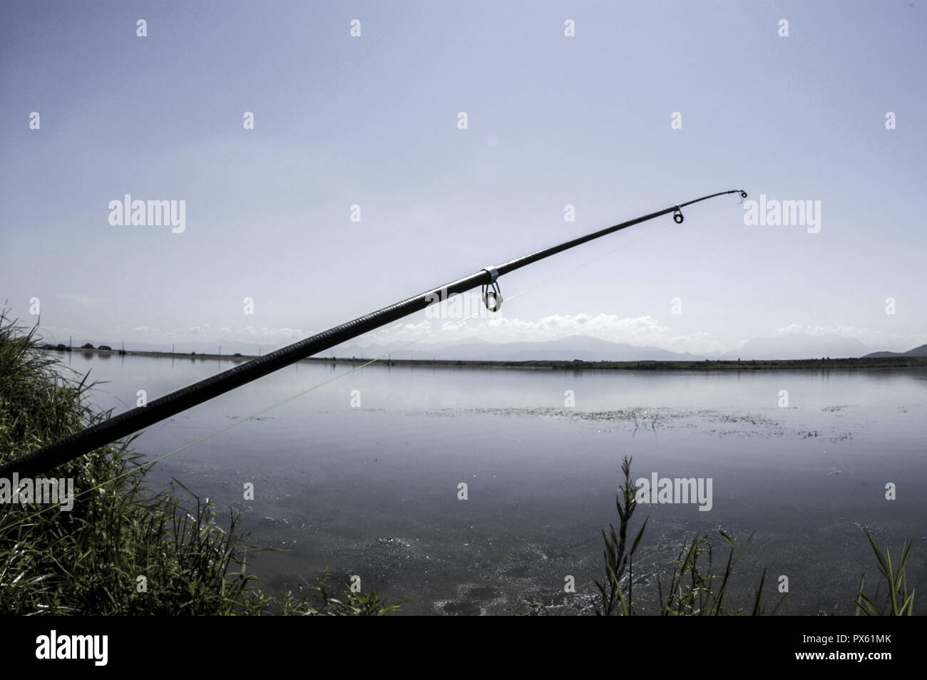 Fishing rod at a lake, Romania, Transsilvania, Brasov area Stock Photo ...