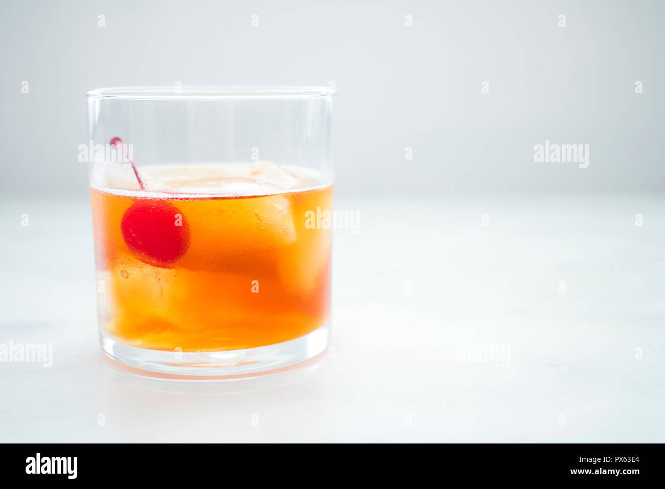 Manhattan Cocktail with Cherry Garnish Stock Photo - Alamy