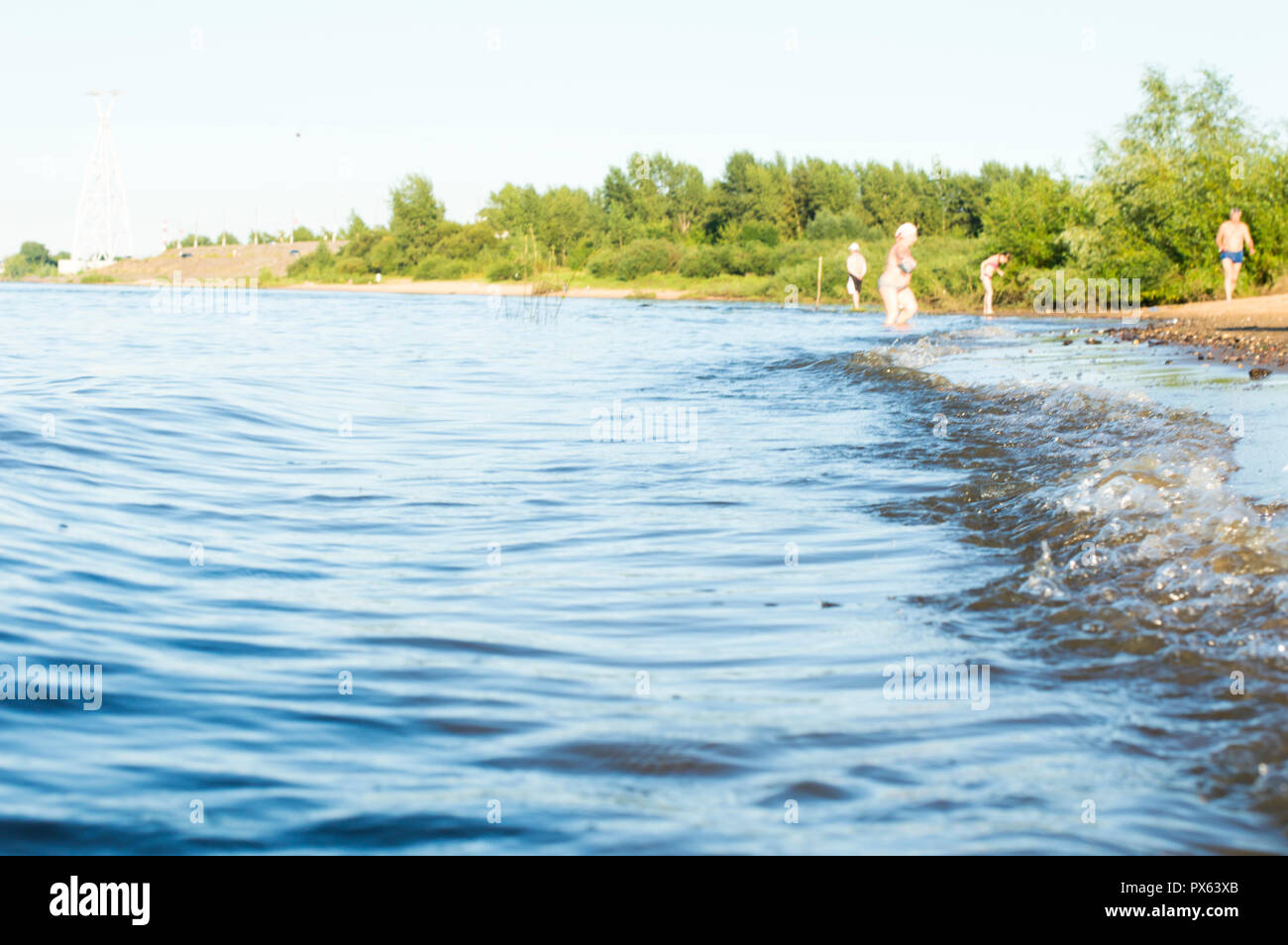 Volga river. Summer, sunny day. Sandy sand. Figures of sand, footprints ...