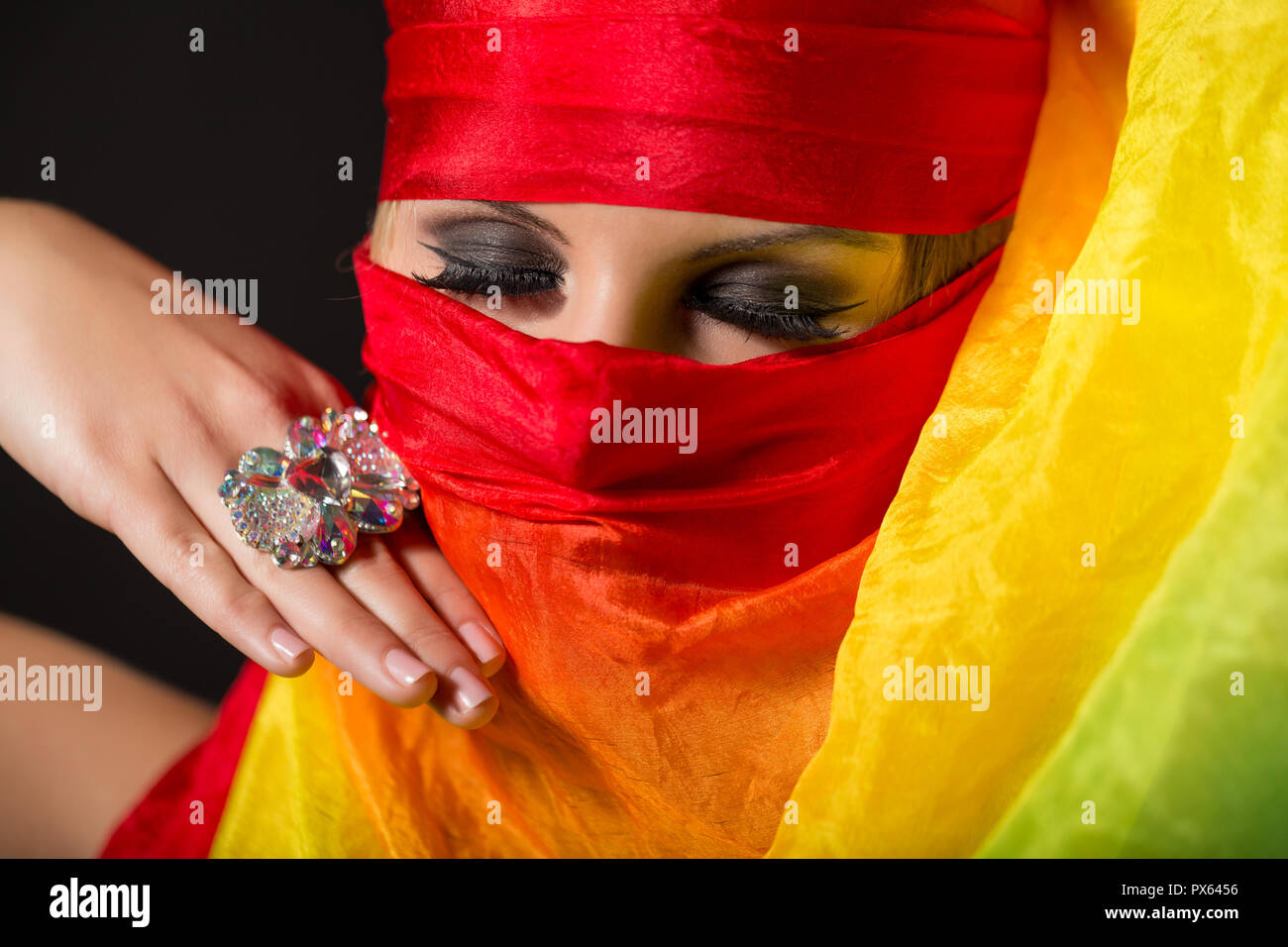 Close up portrait of belly dancer wrapped in veil Stock Photo - Alamy