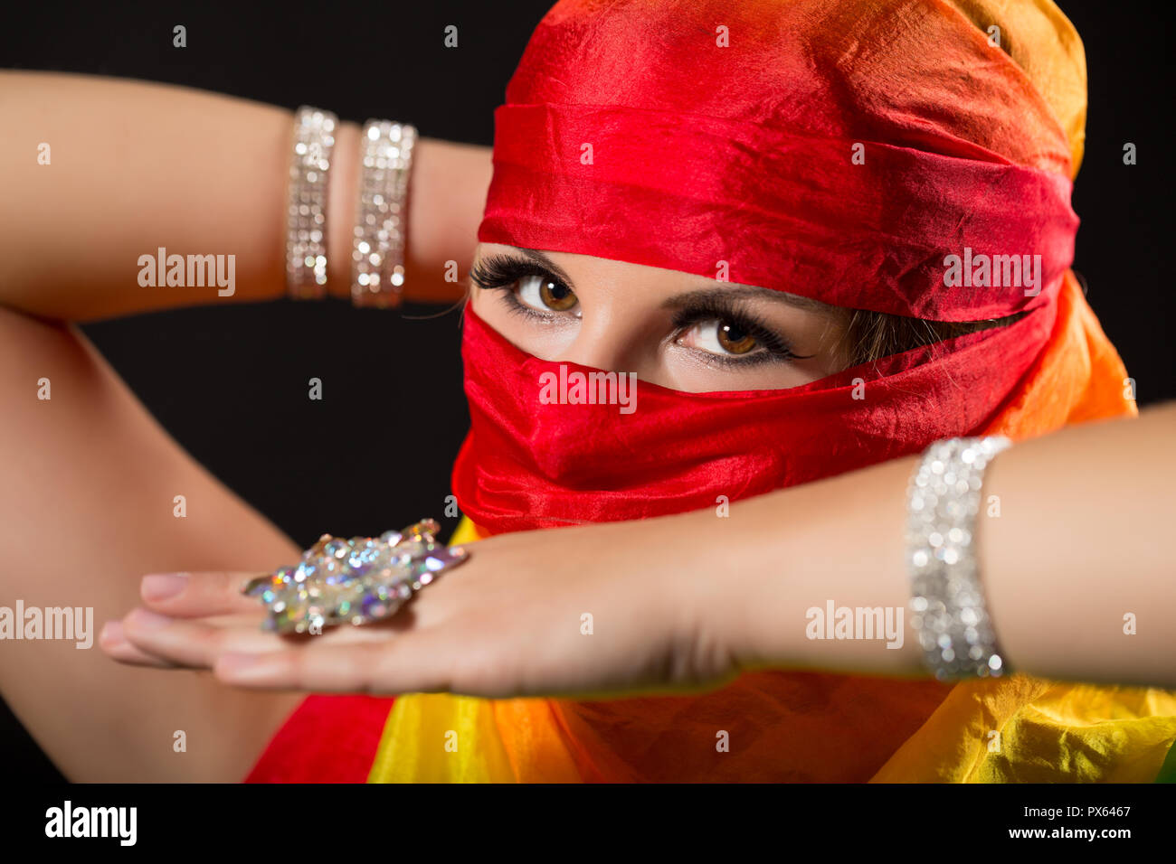Close up portrait of belly dancer wrapped in veil Stock Photo - Alamy