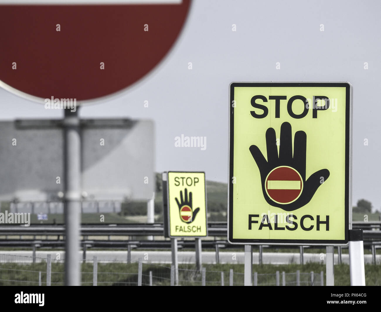 Traffic sign, stop with outstretched hand, false direction, no entry ...