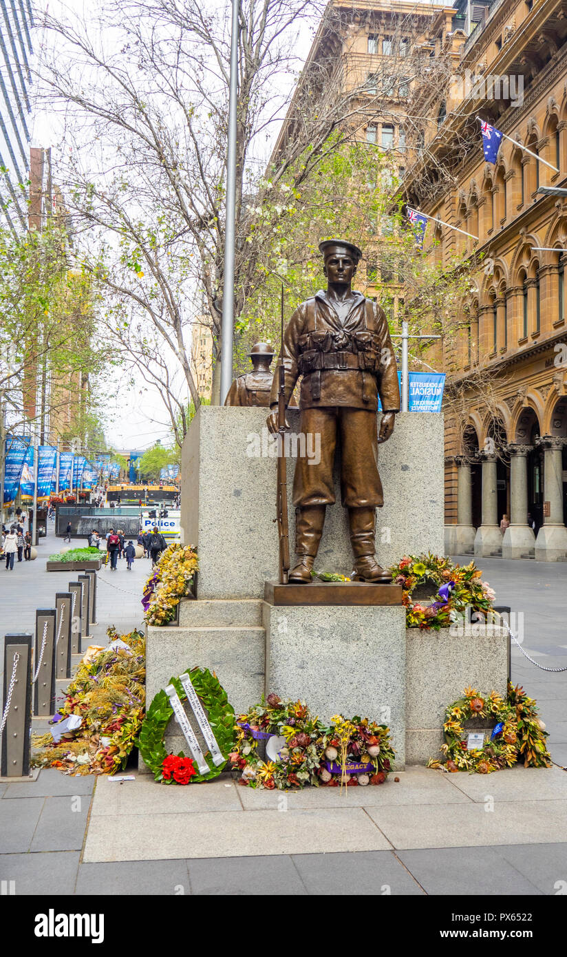 Wreathes placed at base of bronze statue of a sailor commemorating ...