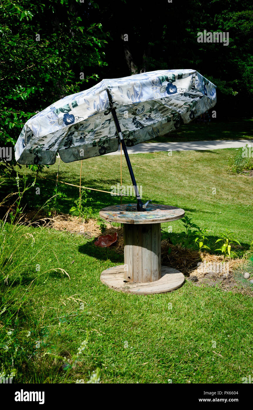 Found objects; garden umbrella in a re-purposed industrial wire spool ...